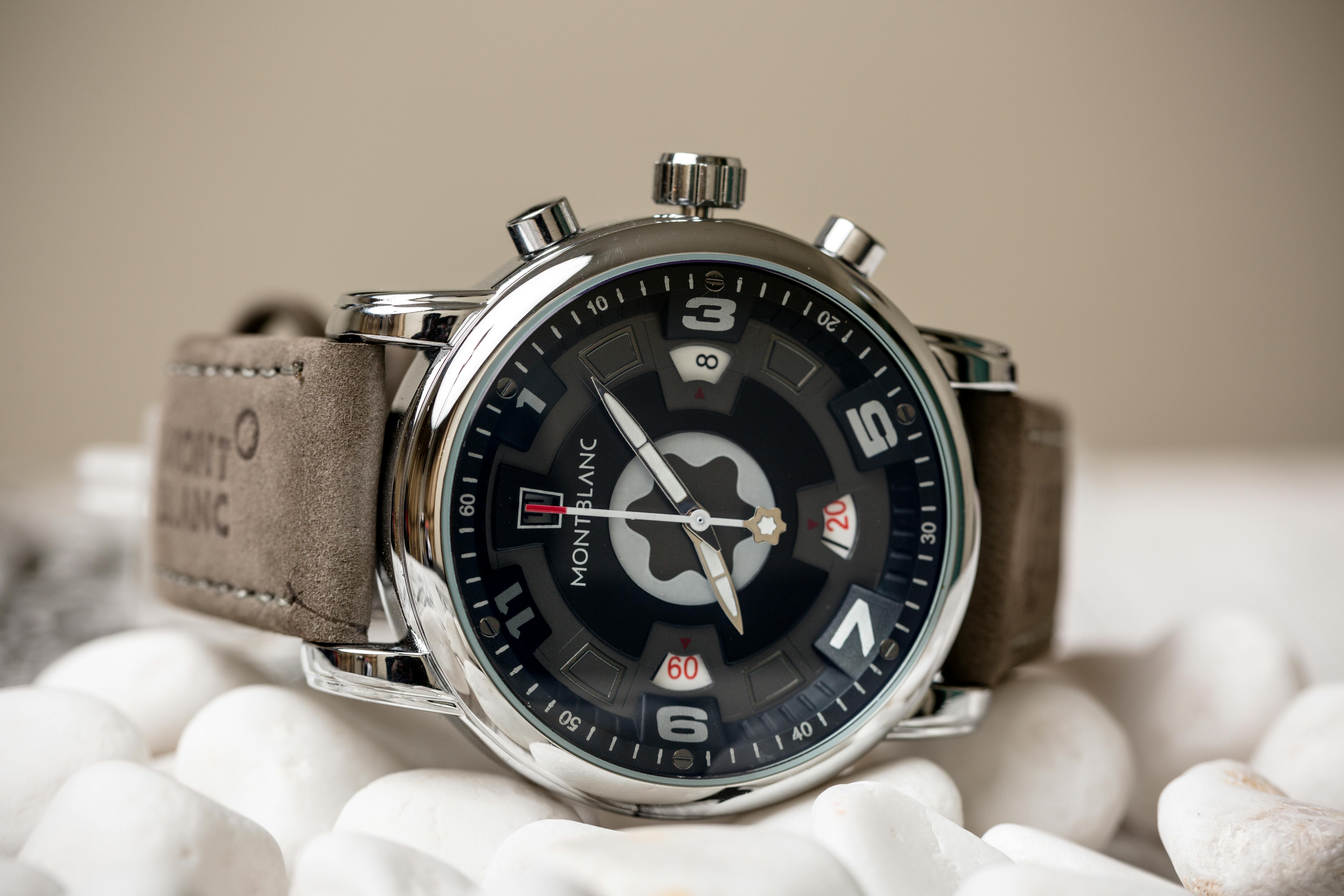 Person Holding Analog Watch Displaying 3:36 · Free Stock Photo