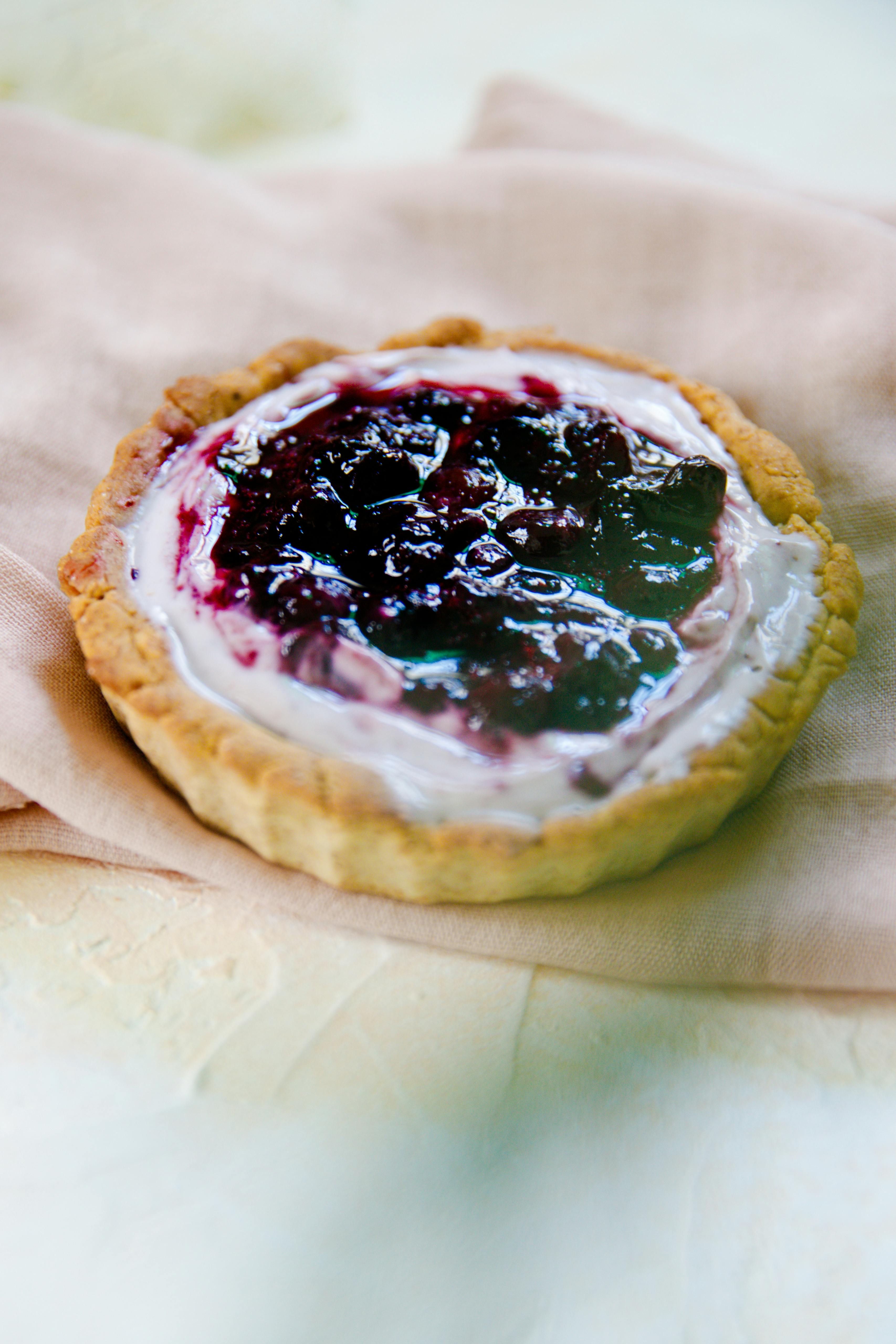A Child Getting a Tart from a Plate · Free Stock Photo