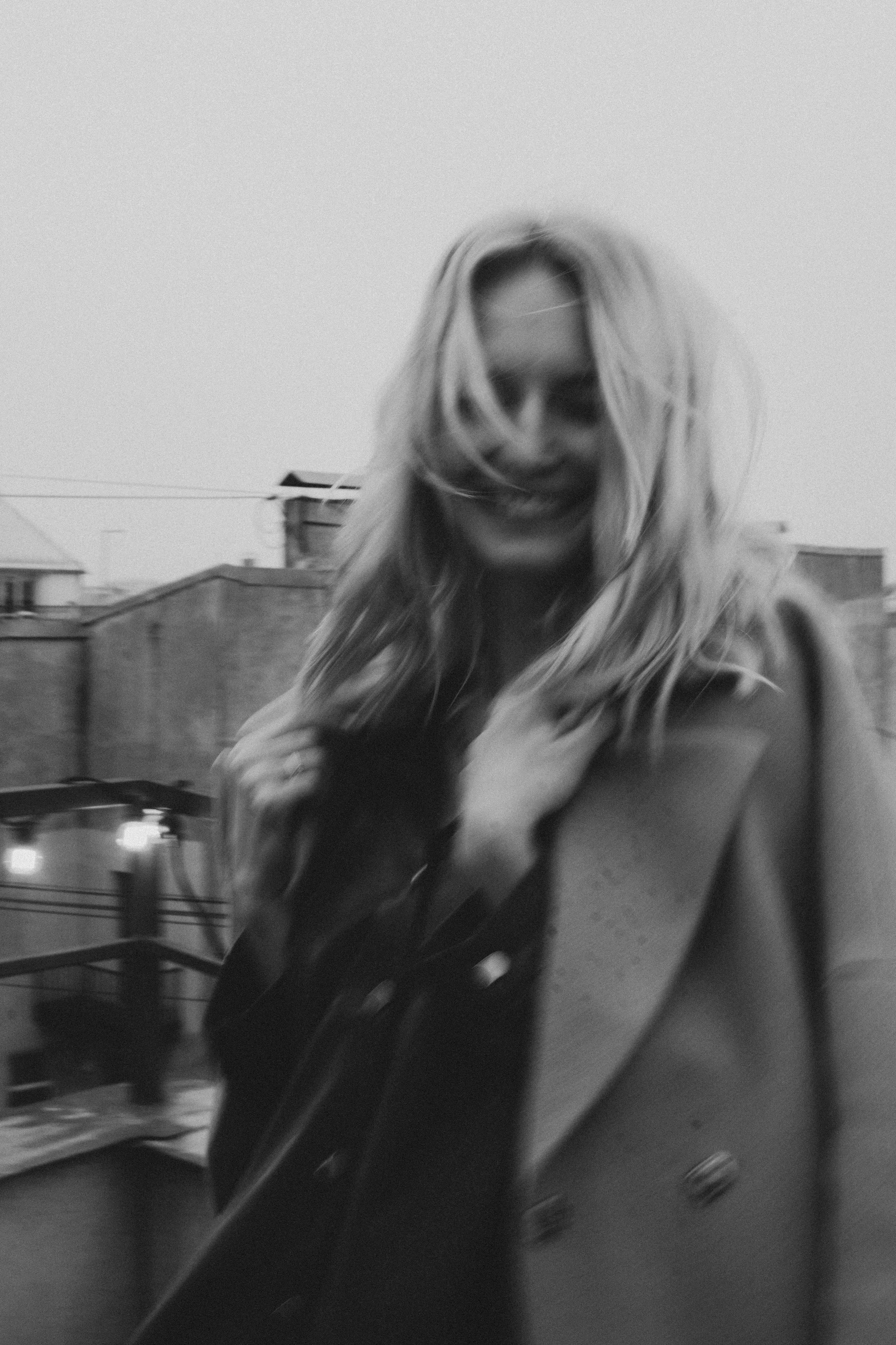 A Female Smiling in Blurred Motion · Free Stock Photo