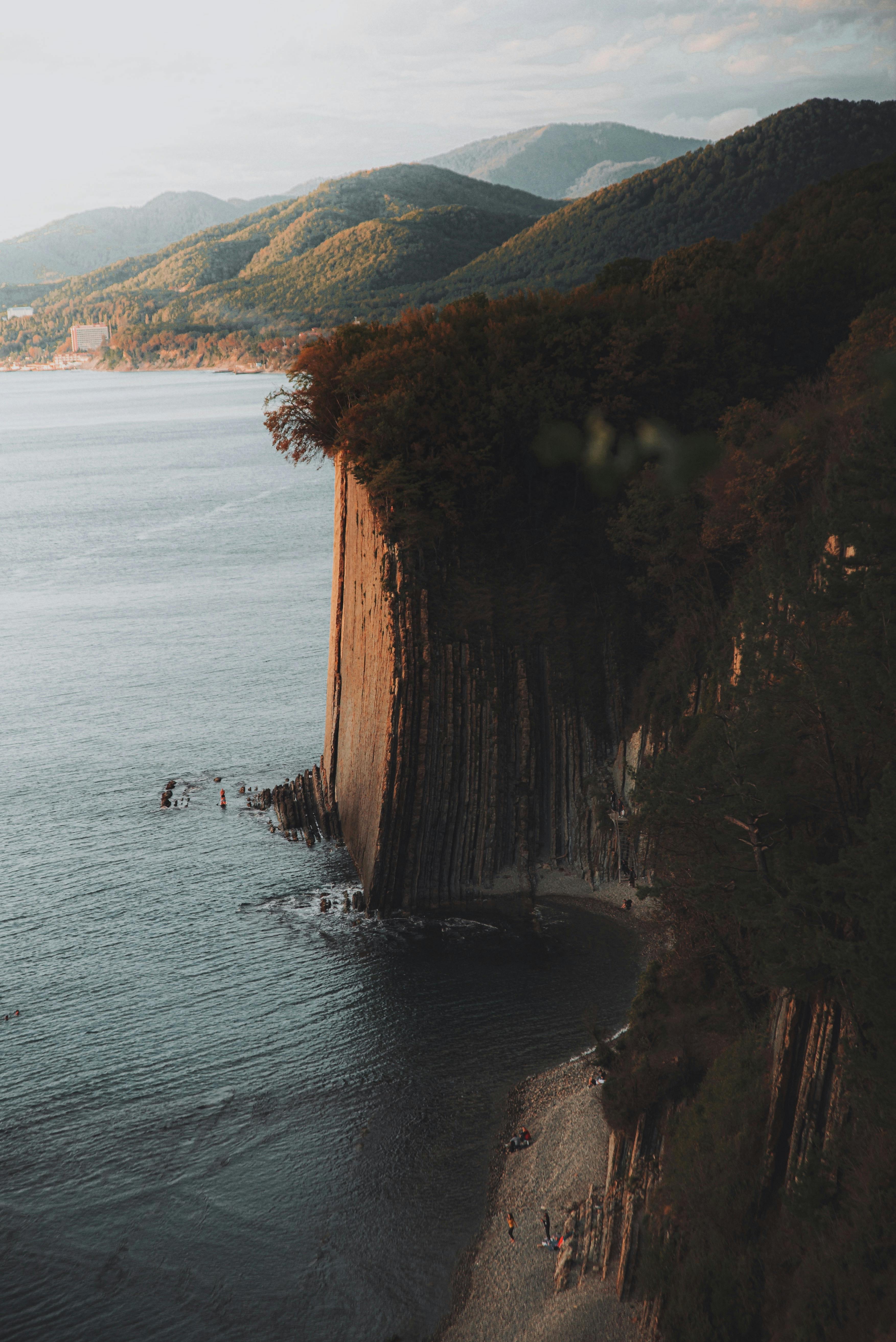 Sloped Cliffs on Seashore · Free Stock Photo
