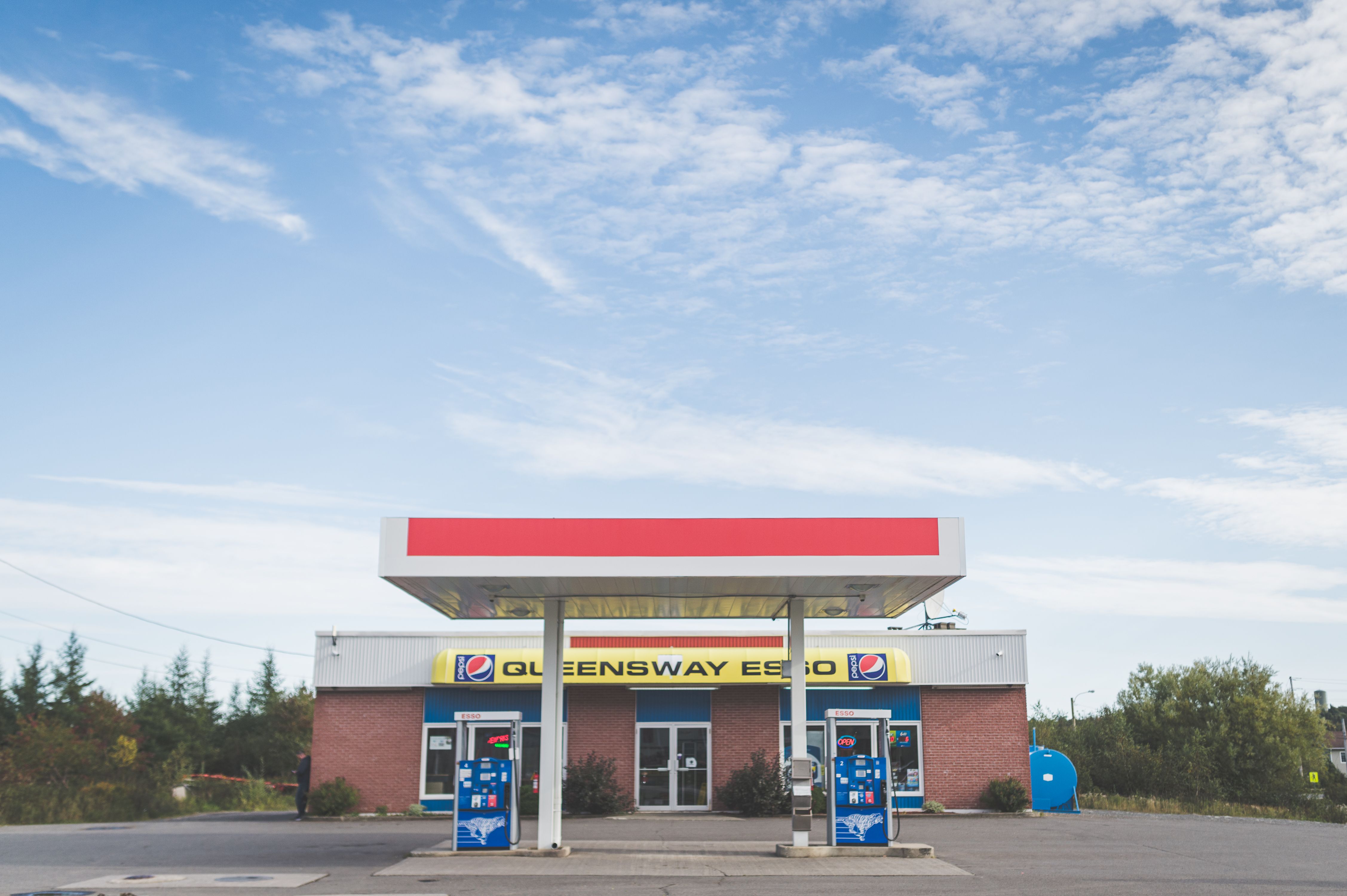 Blue and White Gas Station Under the Blue Sky · Free Stock Photo