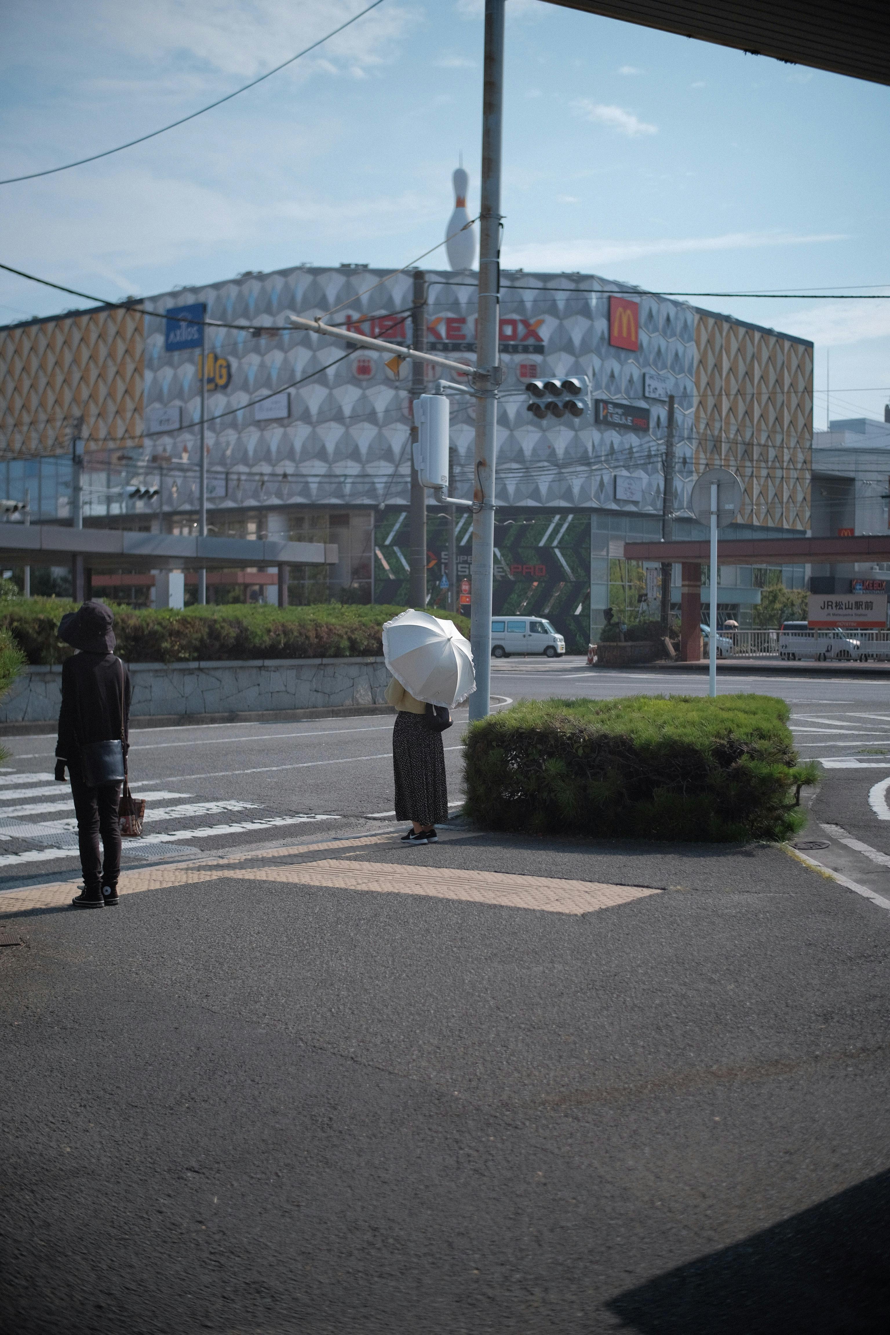 Pedestrians Waiting at Crosswalk · Free Stock Photo