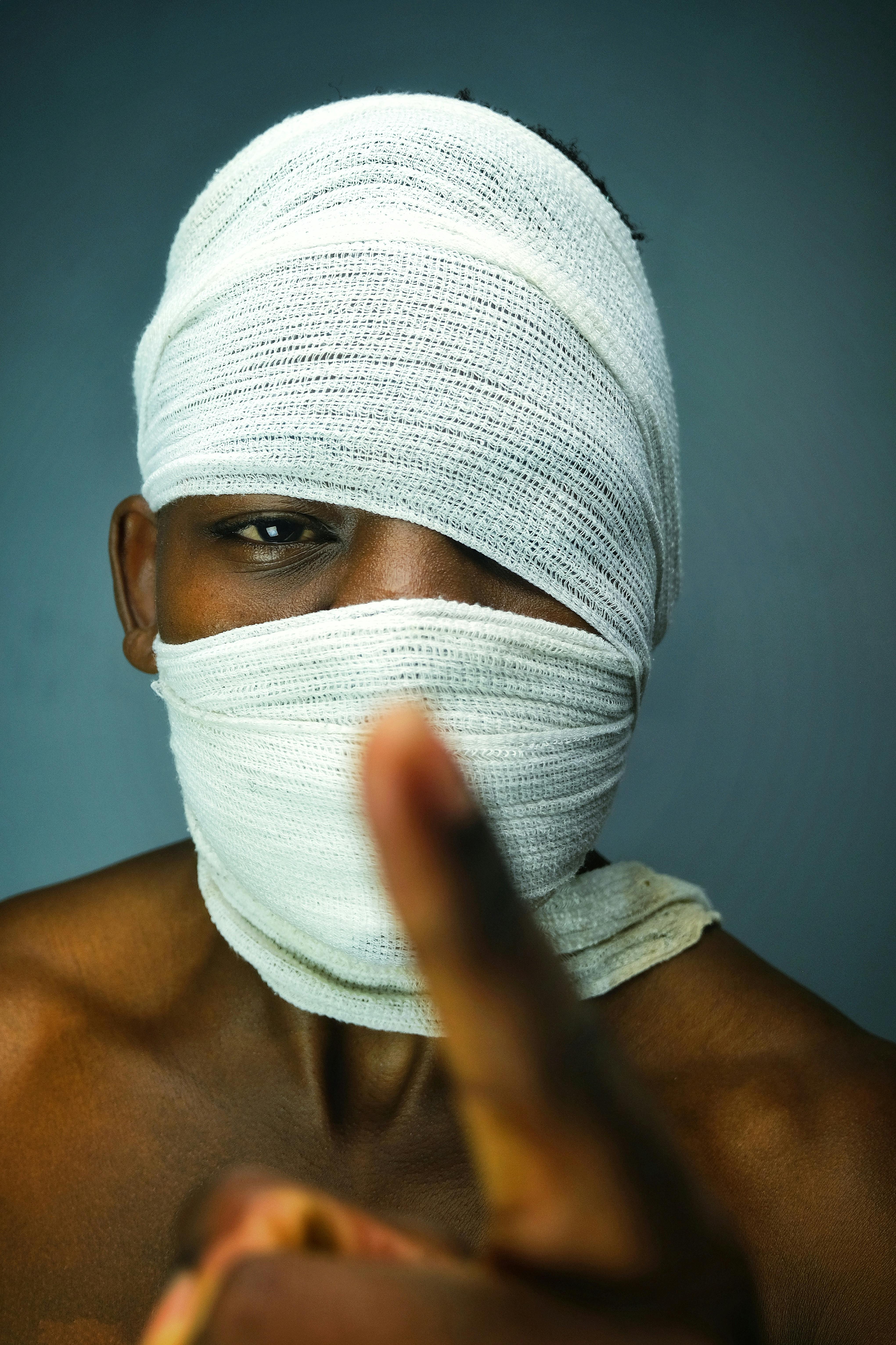 A Man's Head Wrapped with Gauze · Free Stock Photo