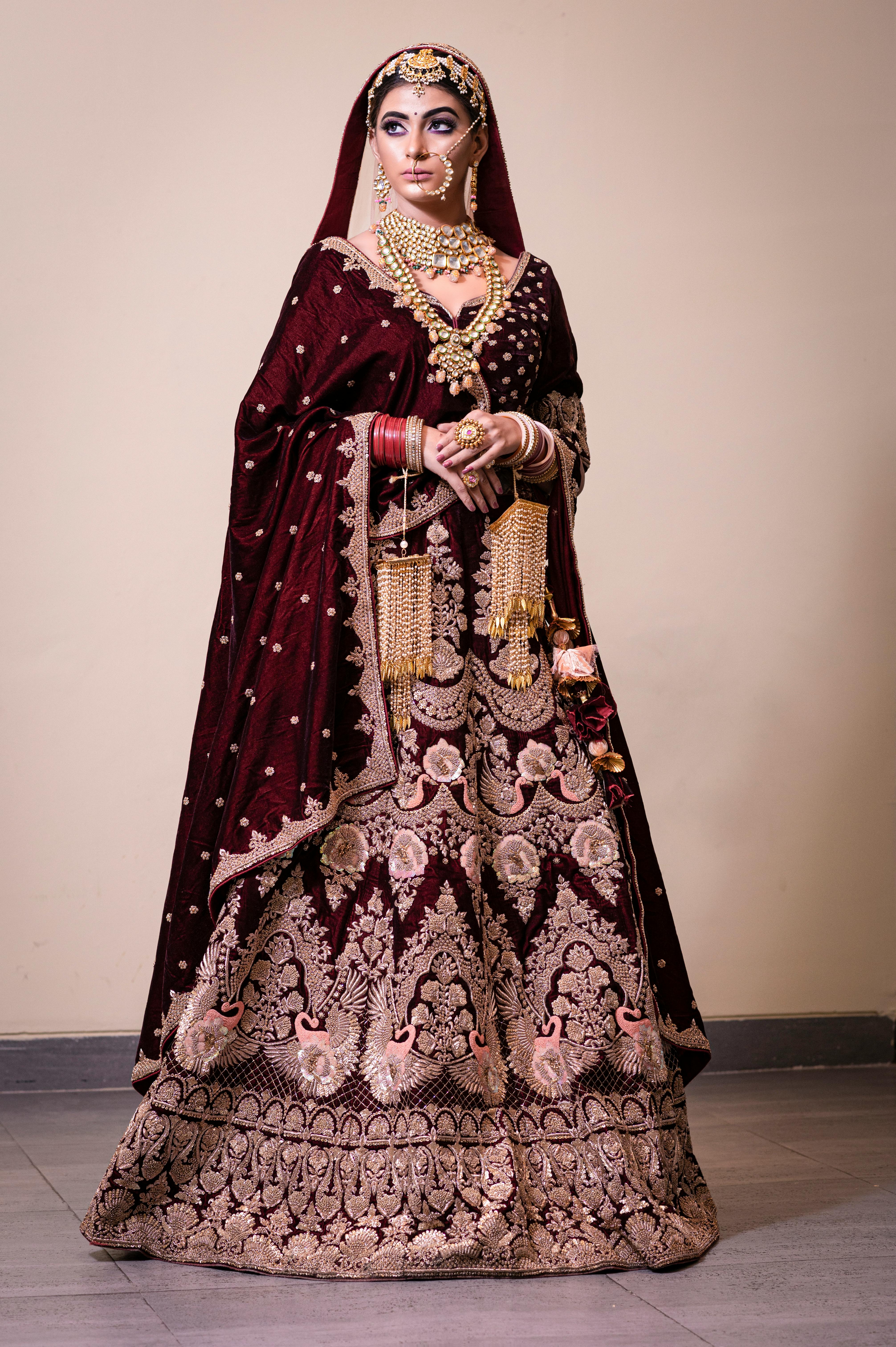 Woman in Red Traditional Dress Standing on Green Grass Field · Free ...
