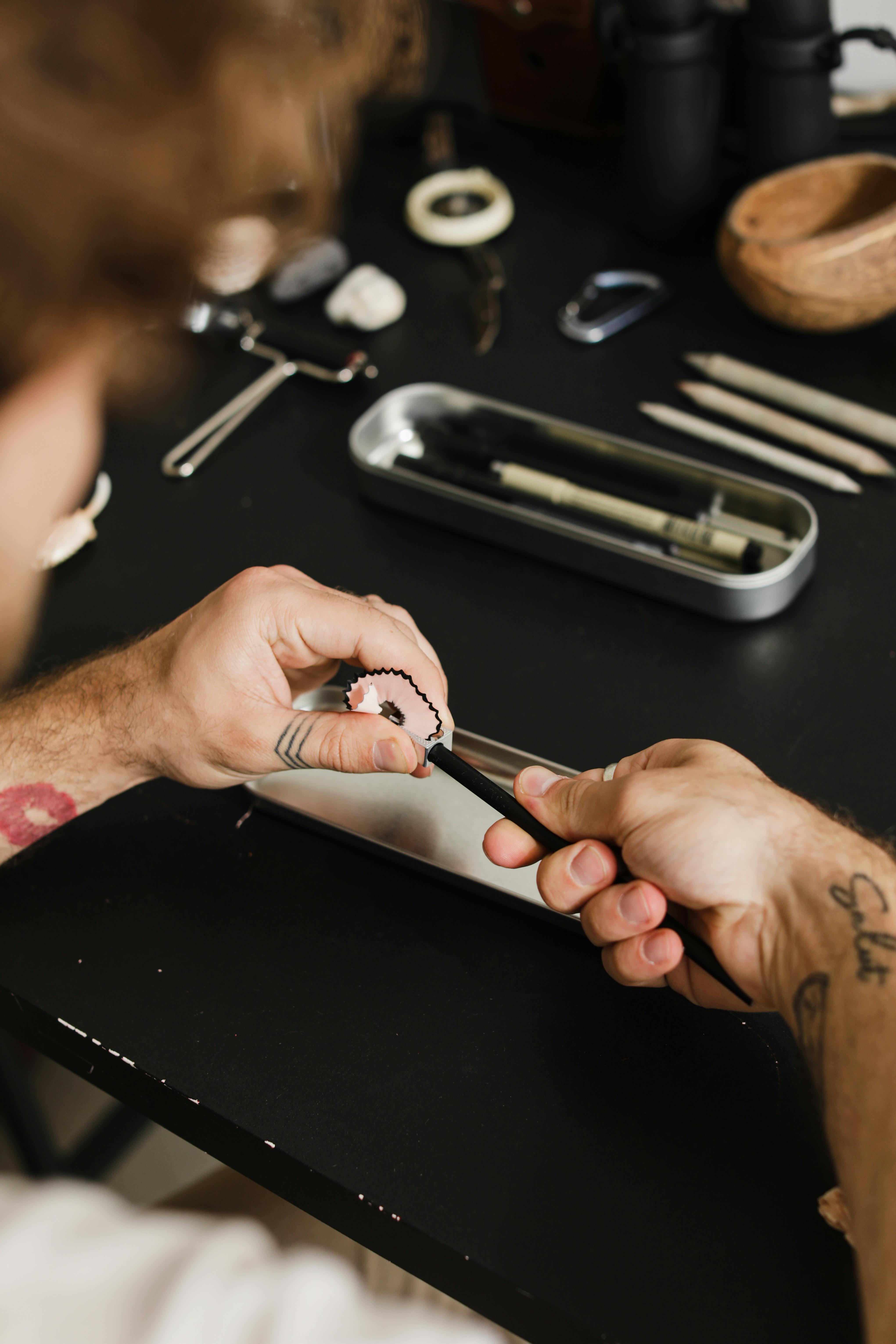 Person Sharpening a Pencil · Free Stock Photo