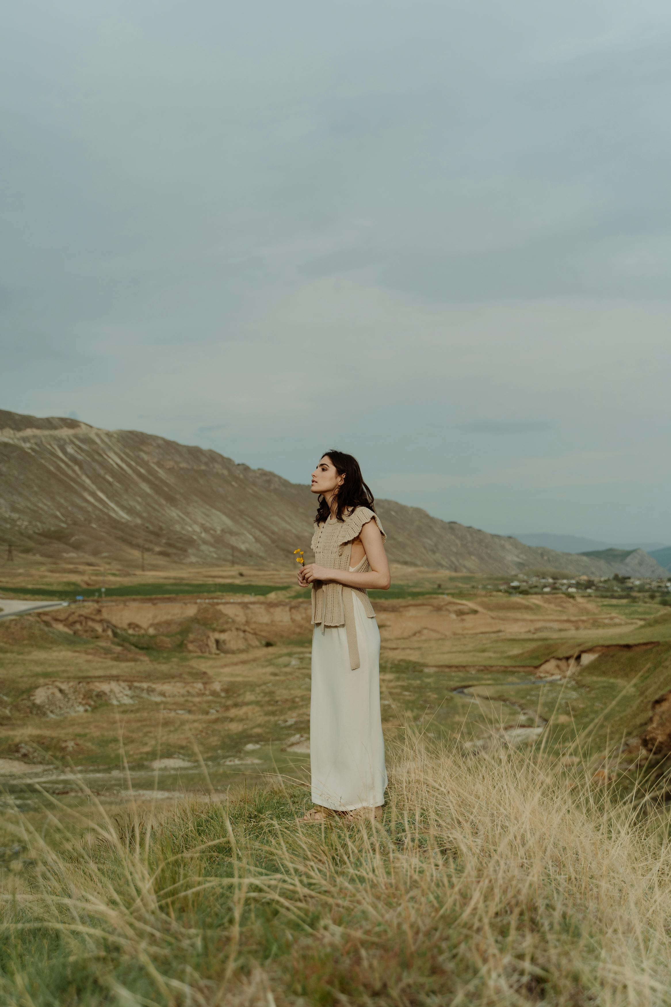 A Woman in Pilot Uniform Standing Infront of Helicopter · Free Stock Photo