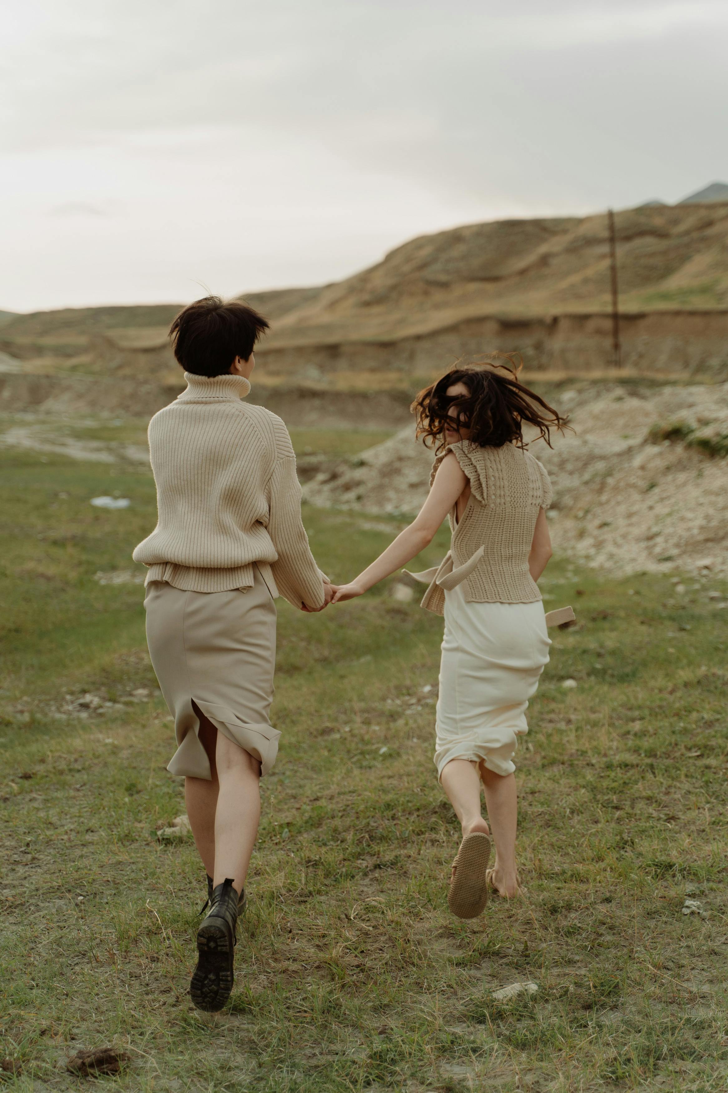 Women Holding Hands While Running · Free Stock Photo