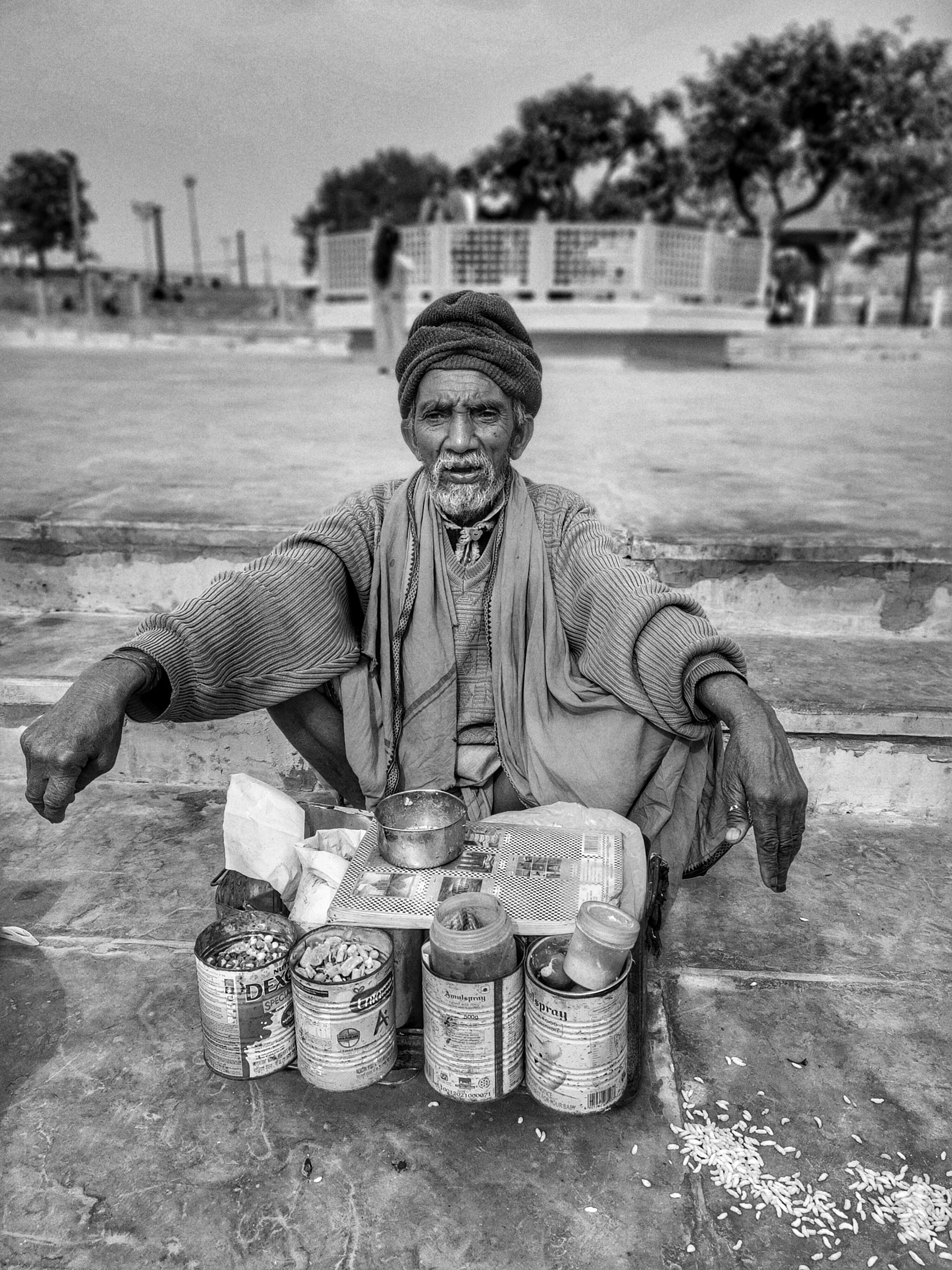 Monochrome Photo of an Elderly Vendor · Free Stock Photo