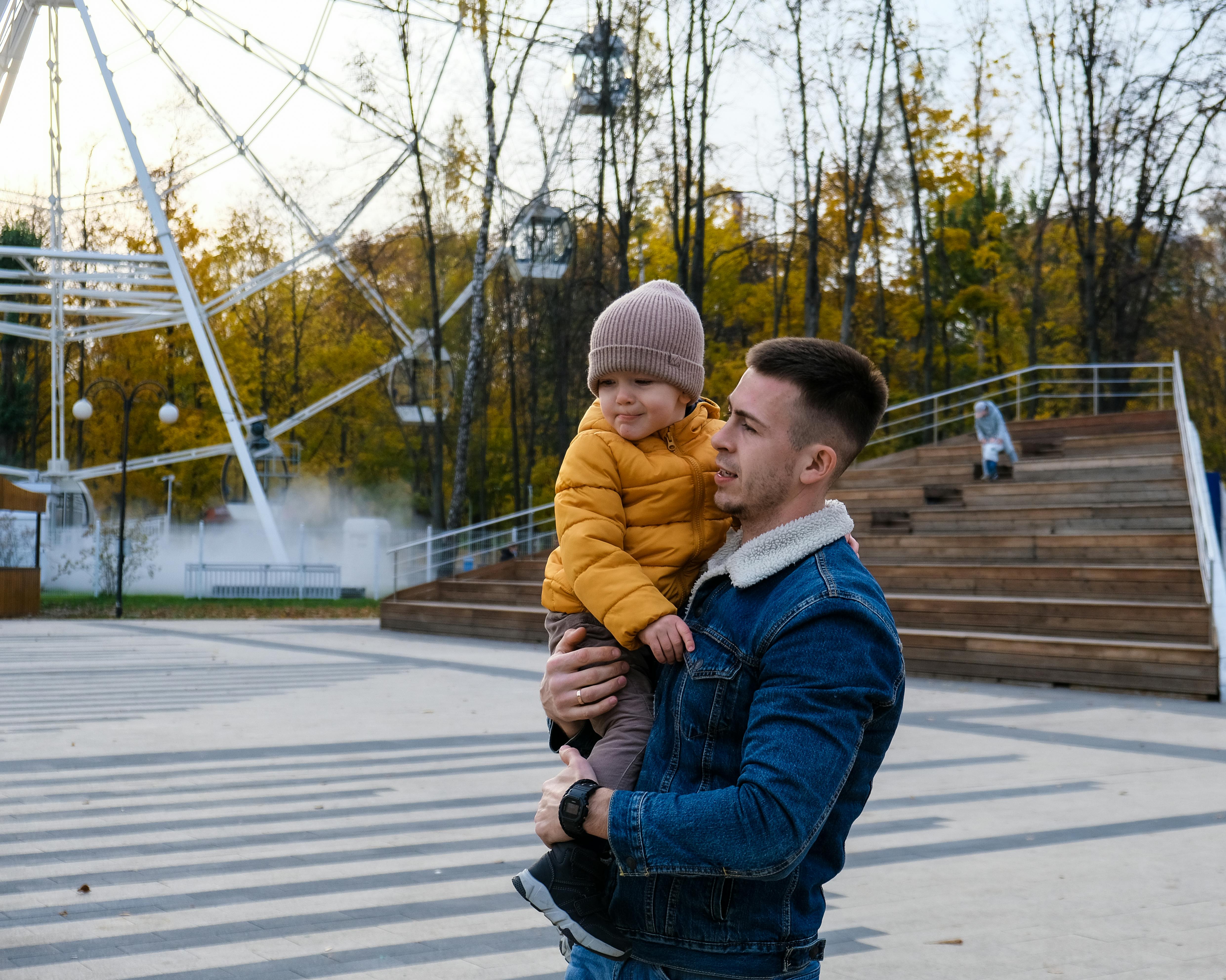 Man Carrying a Child · Free Stock Photo