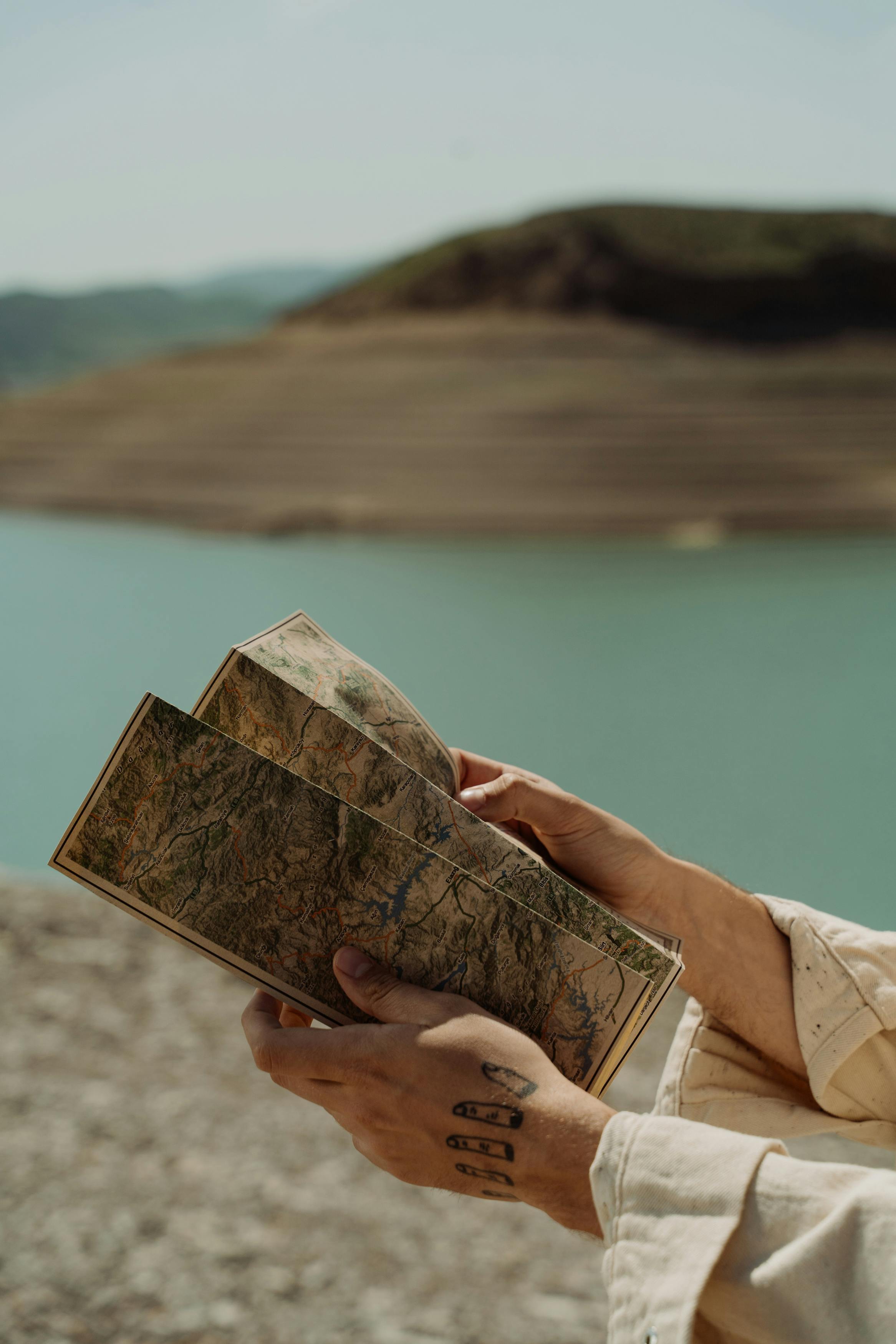 Person holding a Map · Free Stock Photo