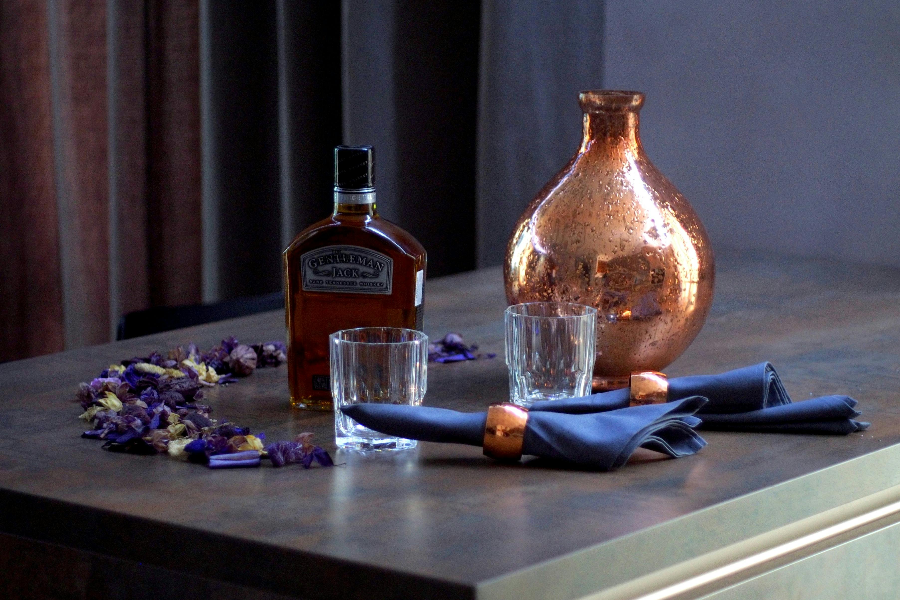 Alcohol Bottle on Table · Free Stock Photo