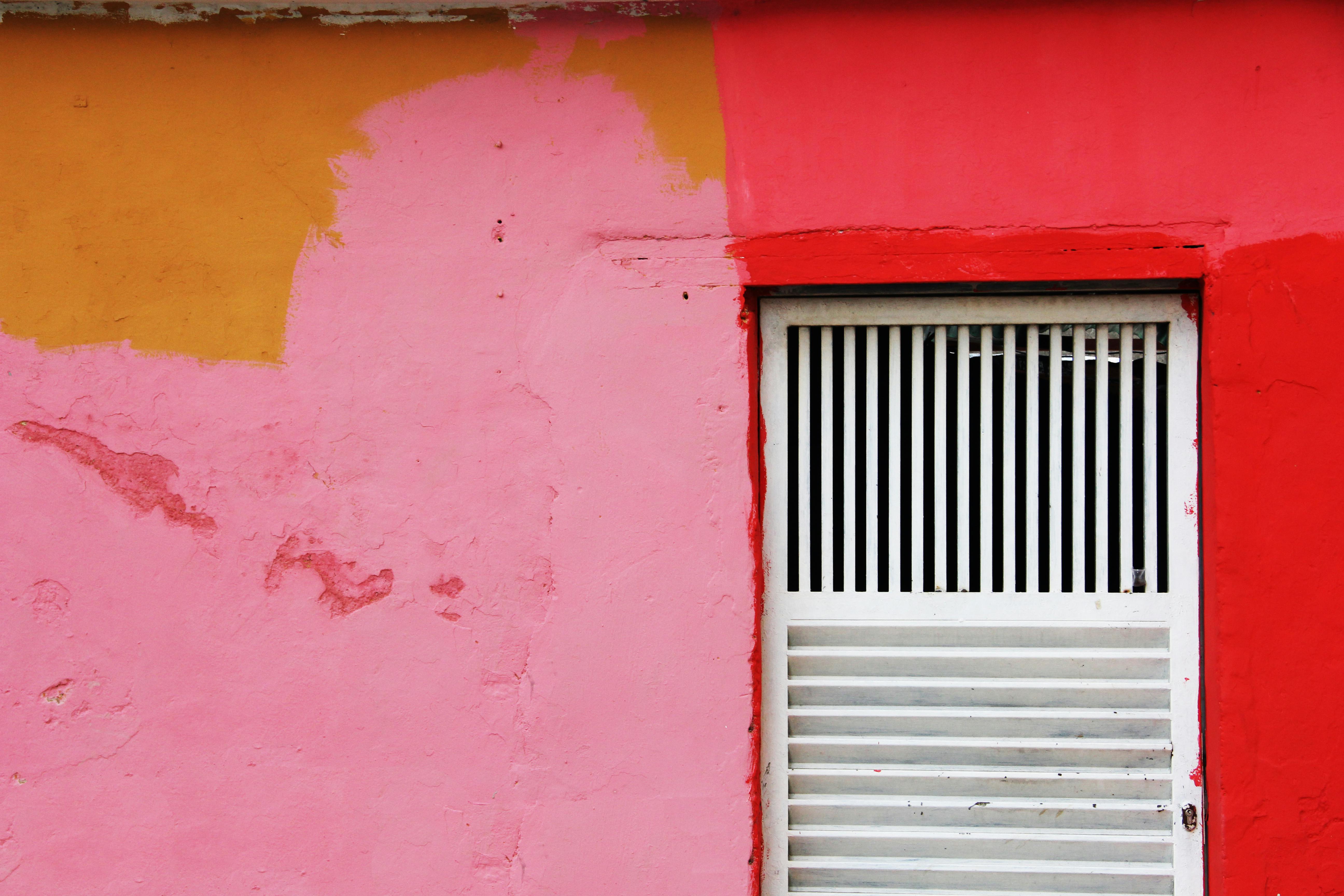 Orange Gate with Wrought Iron Design · Free Stock Photo