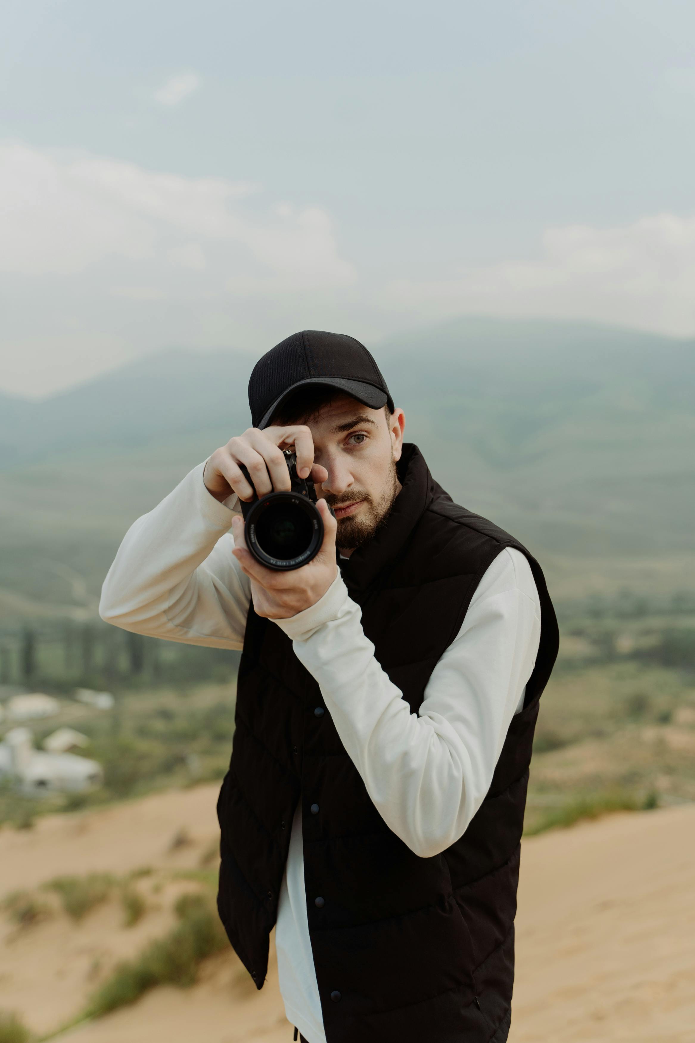 Backpacker Photographing with Camera · Free Stock Photo