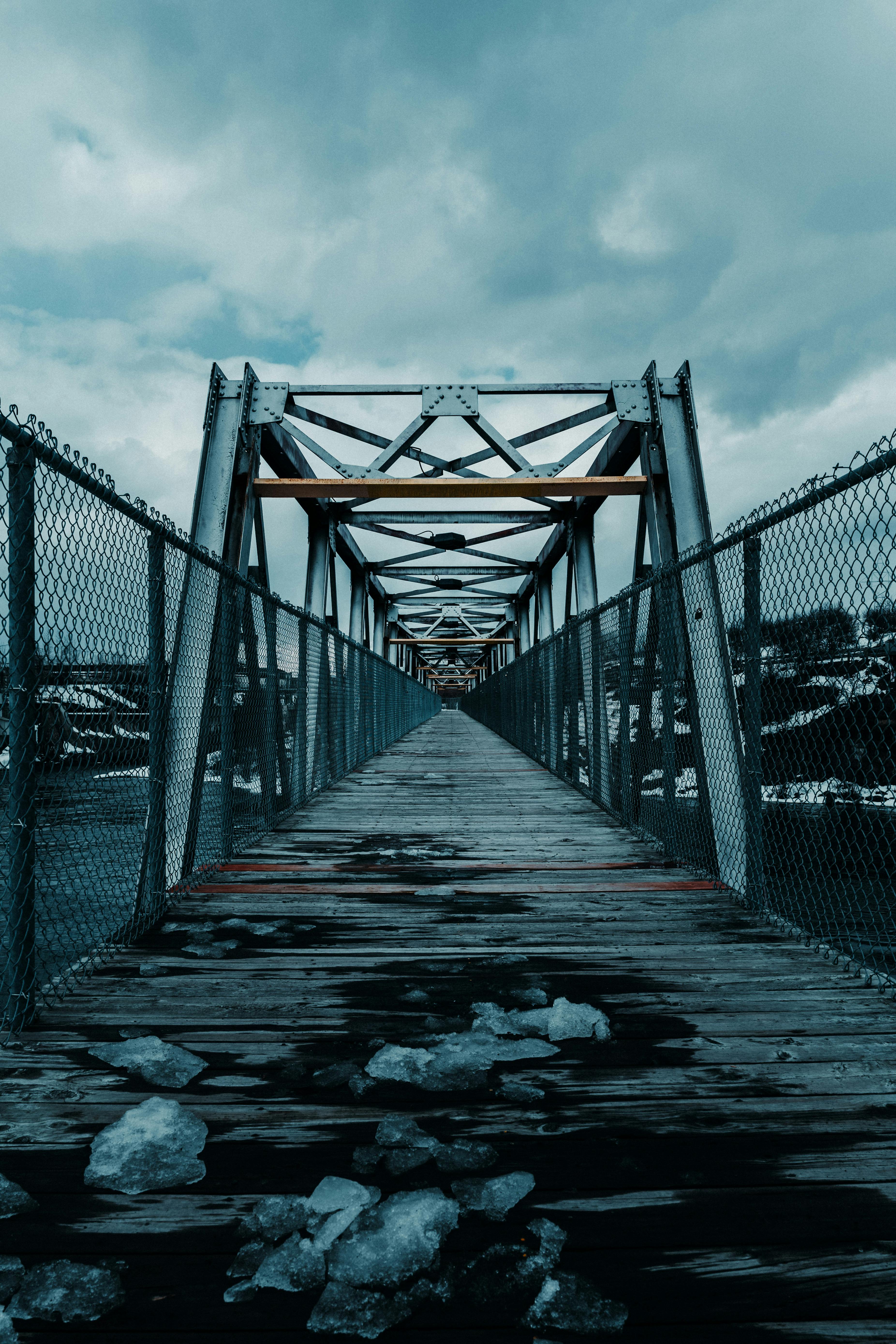 Wooden Walkway of a Bridge with Metal Railings · Free Stock Photo