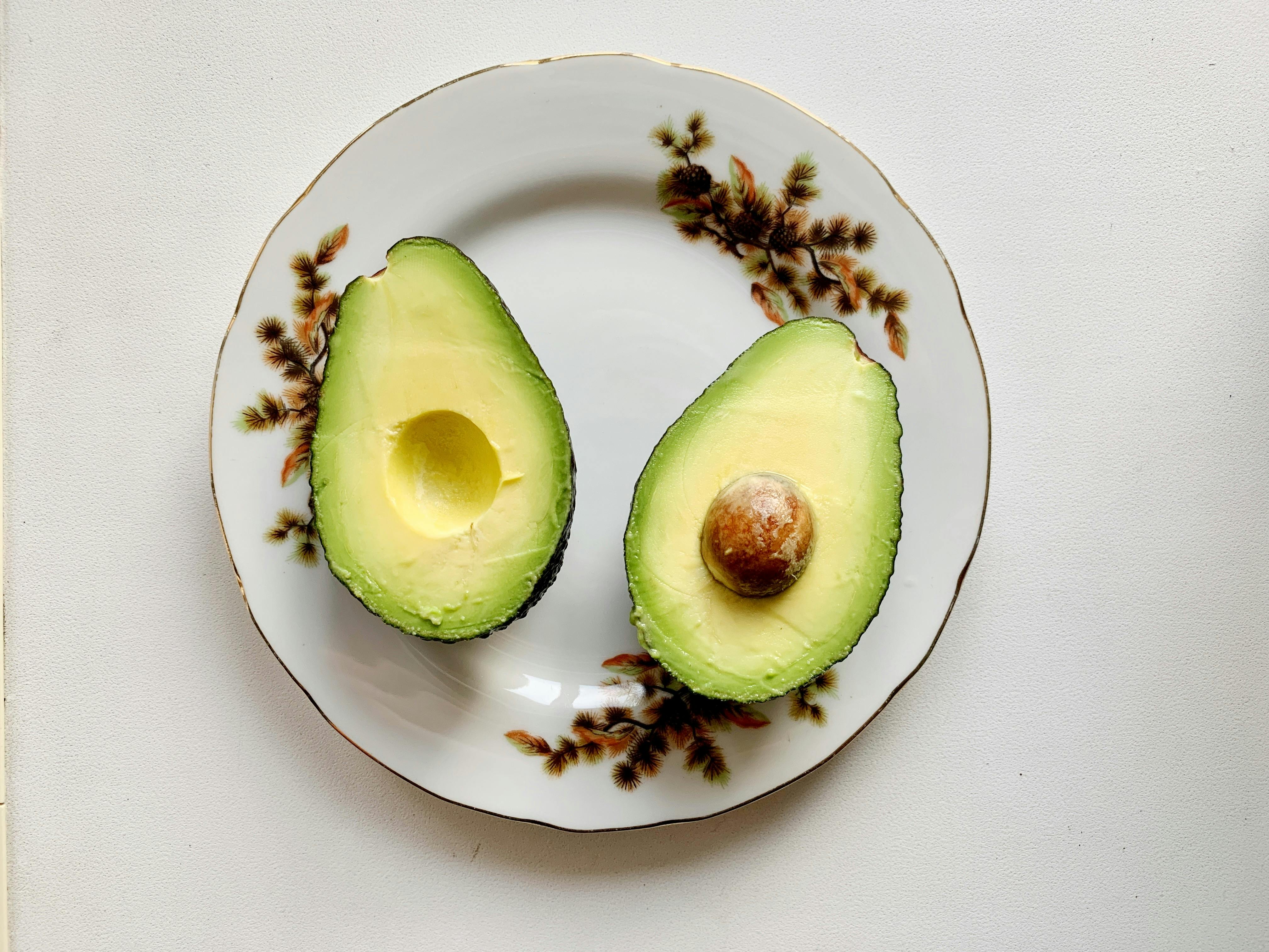 Sliced Avocado on White Ceramic Plate · Free Stock Photo