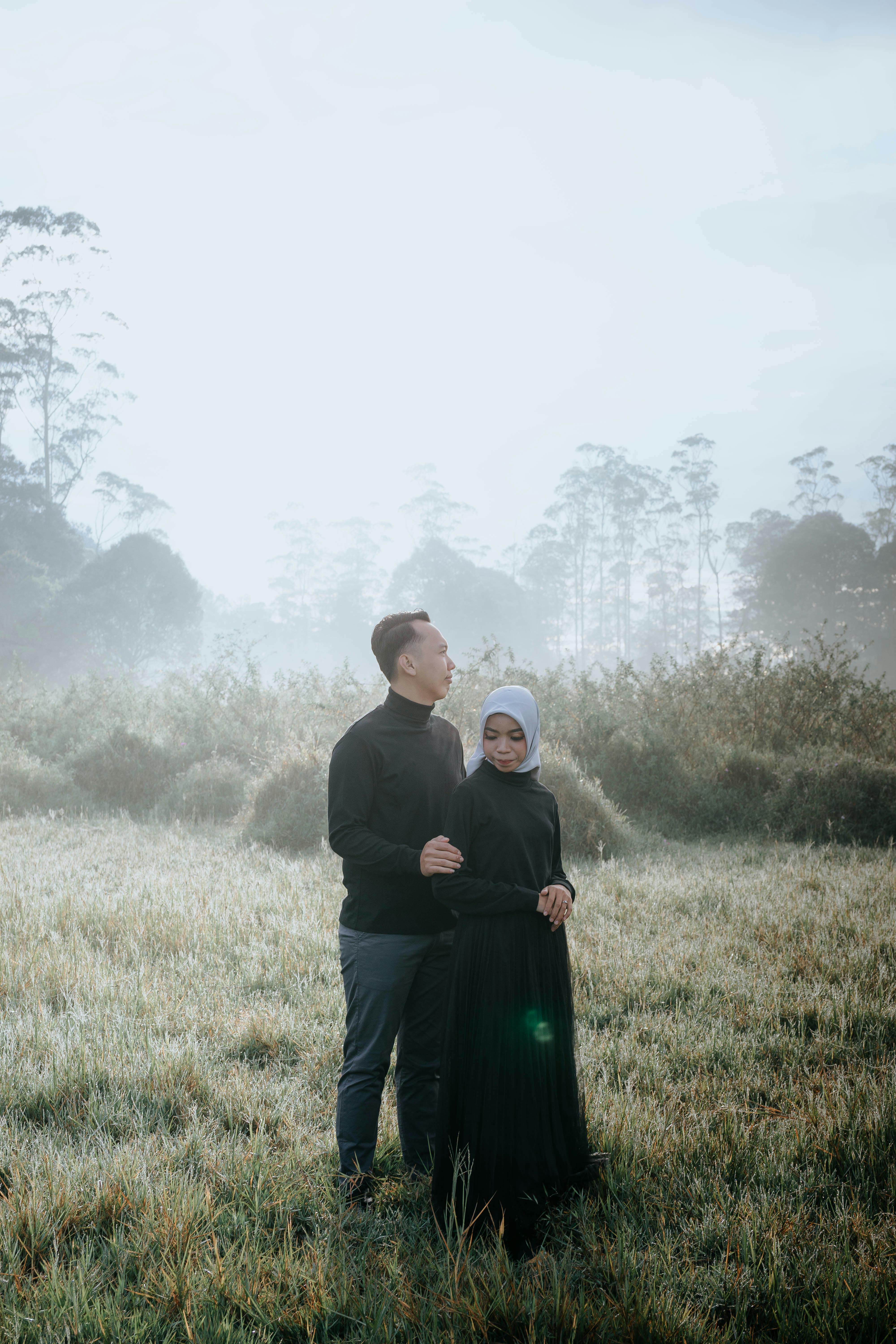 Man Touching the Woman's Arm · Free Stock Photo