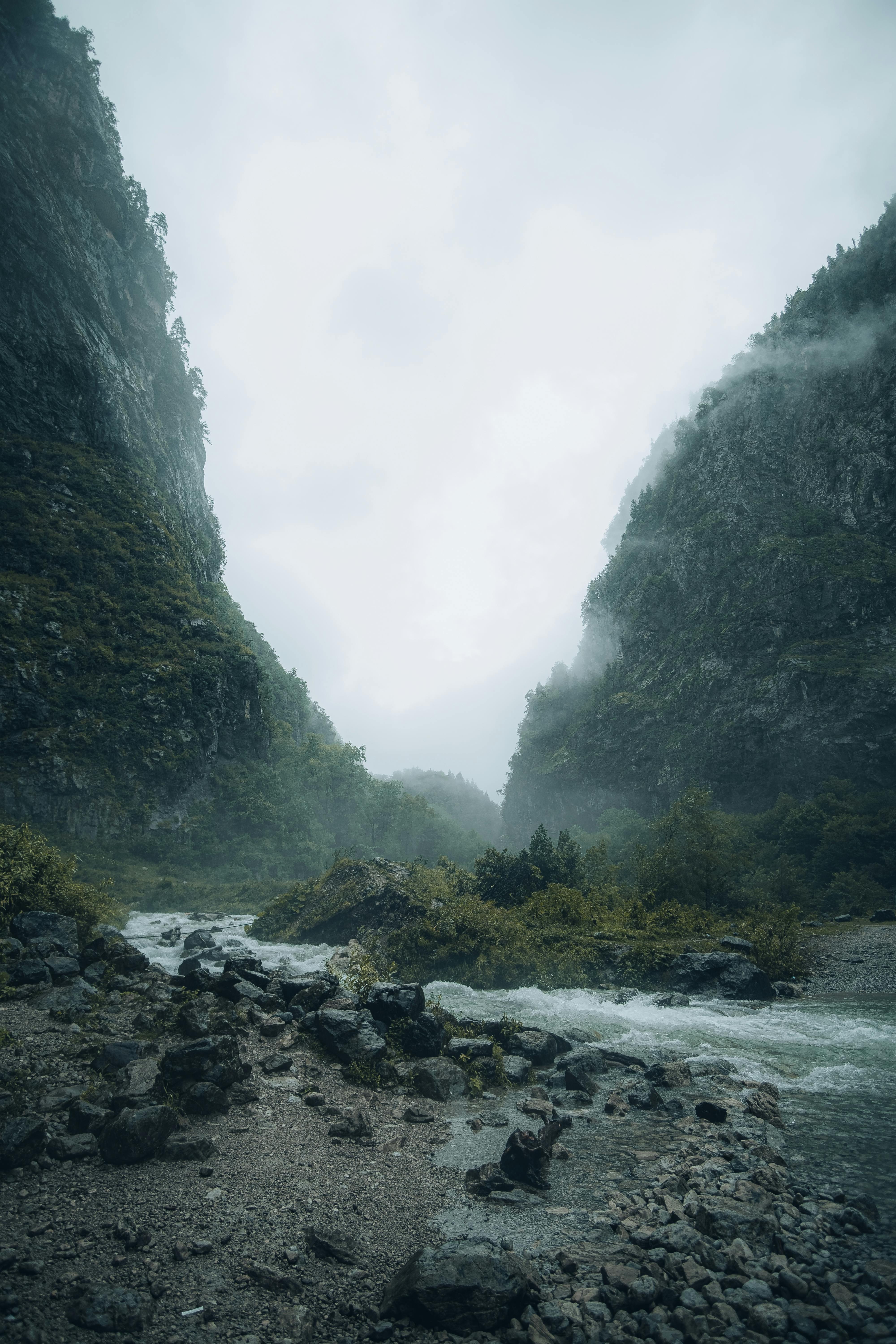 River Between Rock Mountains · Free Stock Photo