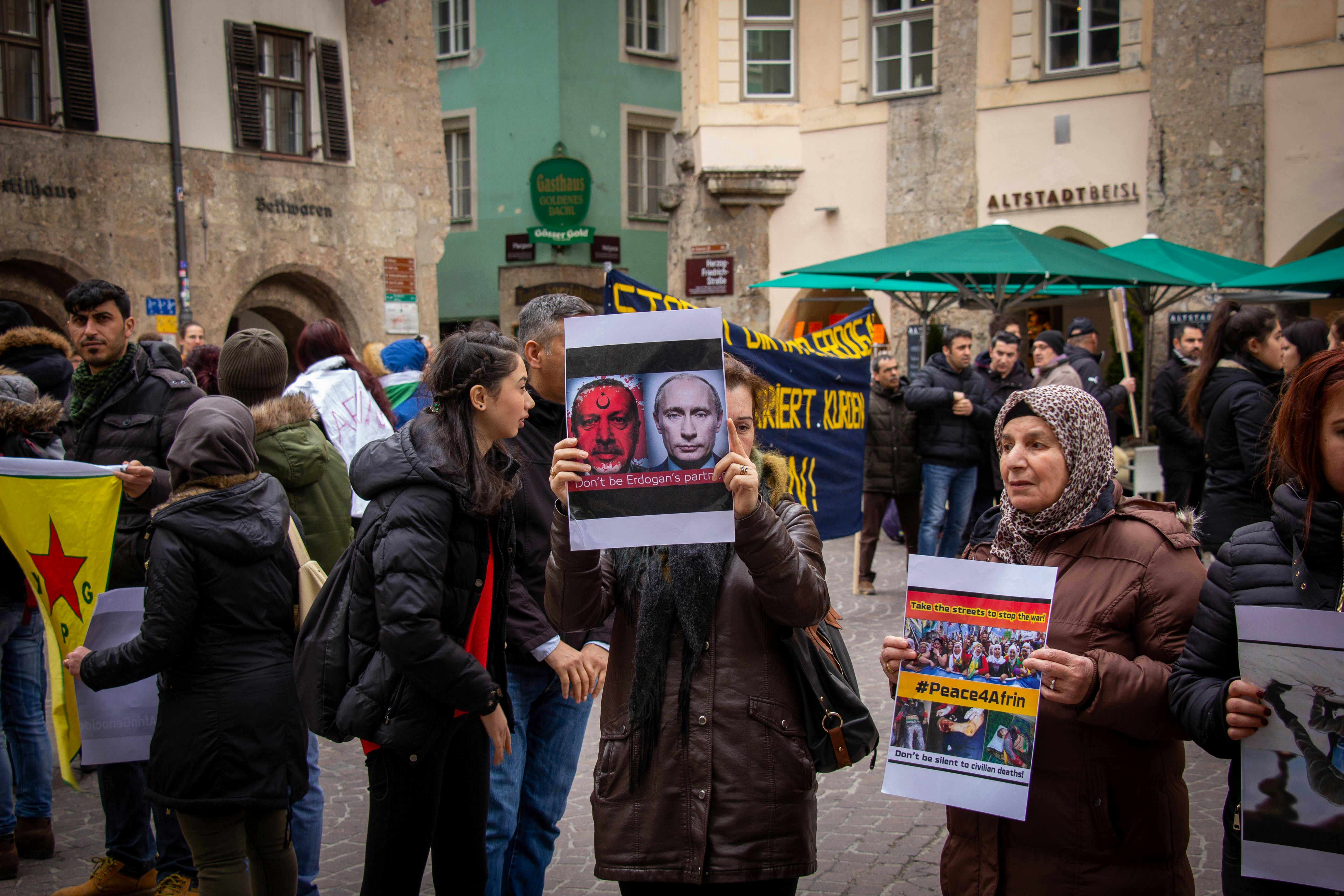 Rallyists Standing on the Street While Holding Posters · Free Stock Photo