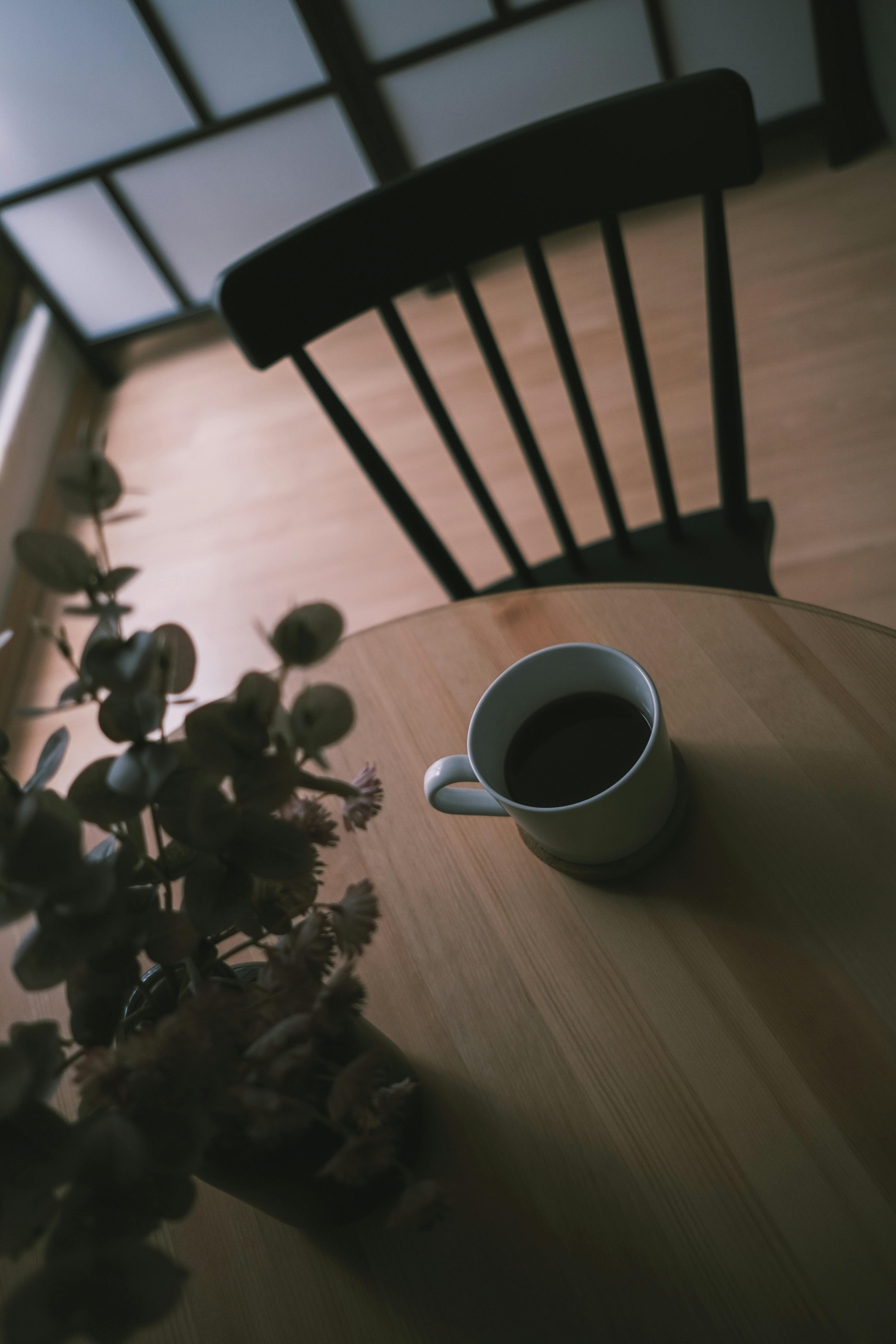 Coffee Mug on Brown Wooden Dining Table · Free Stock Photo