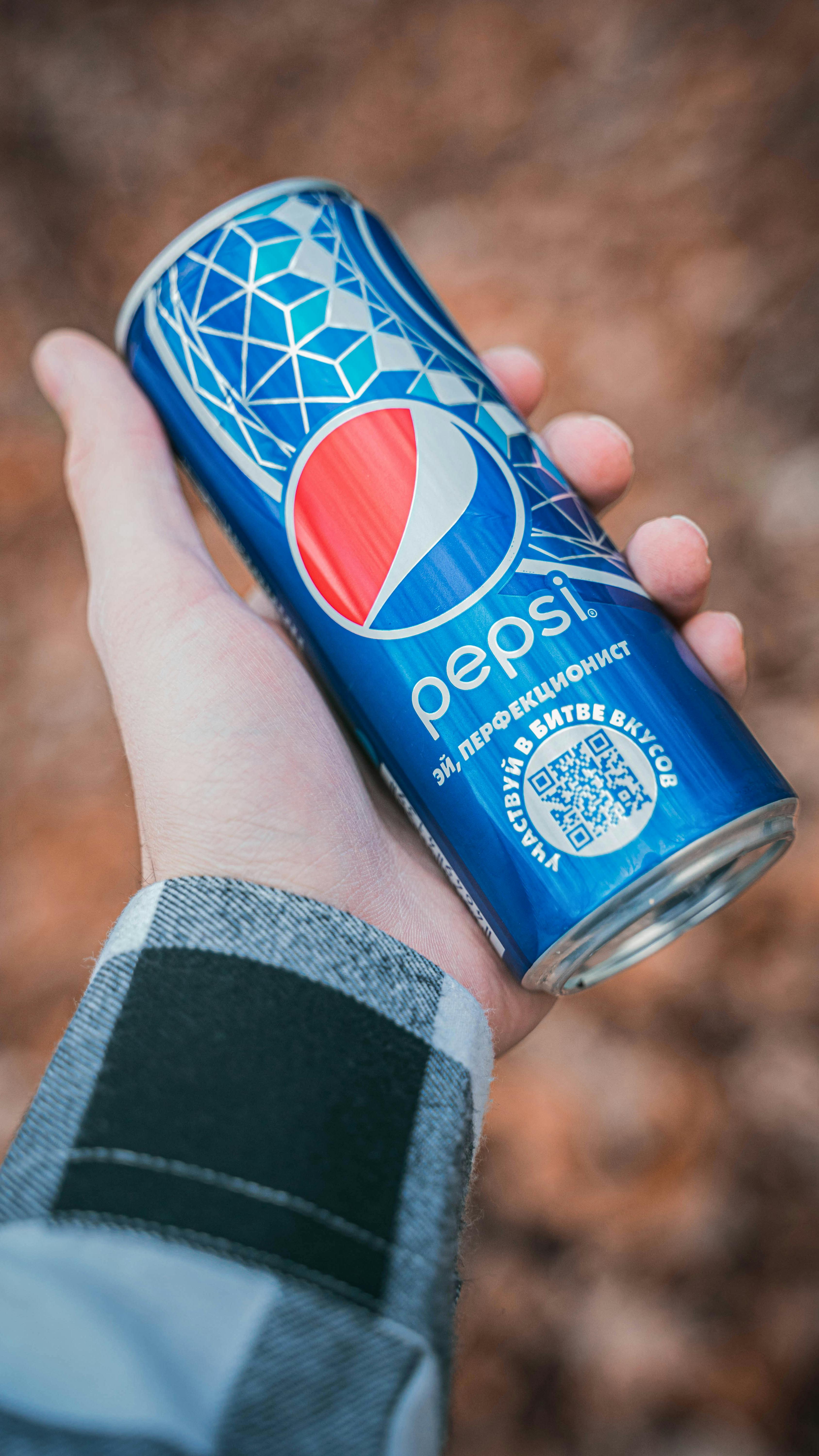 Hand Holding a Pepsi Can · Free Stock Photo