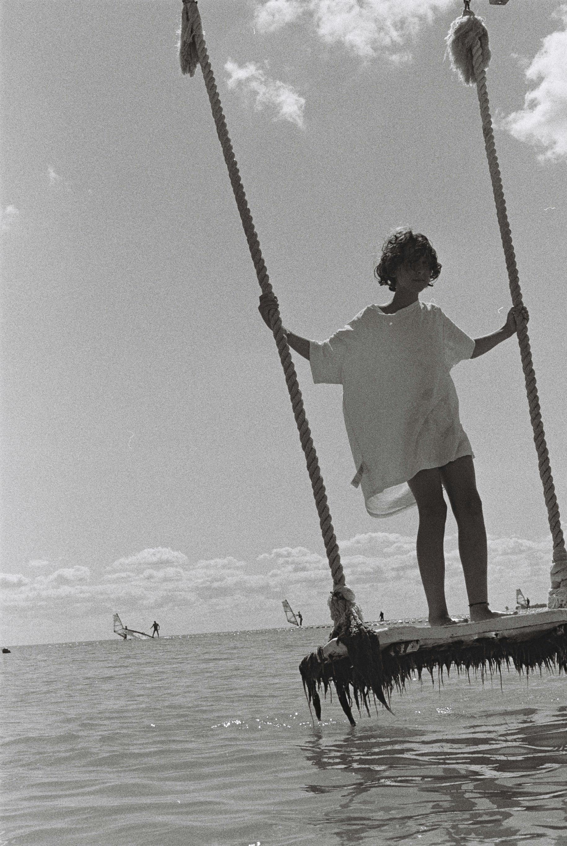 Person Swinging on Rope · Free Stock Photo