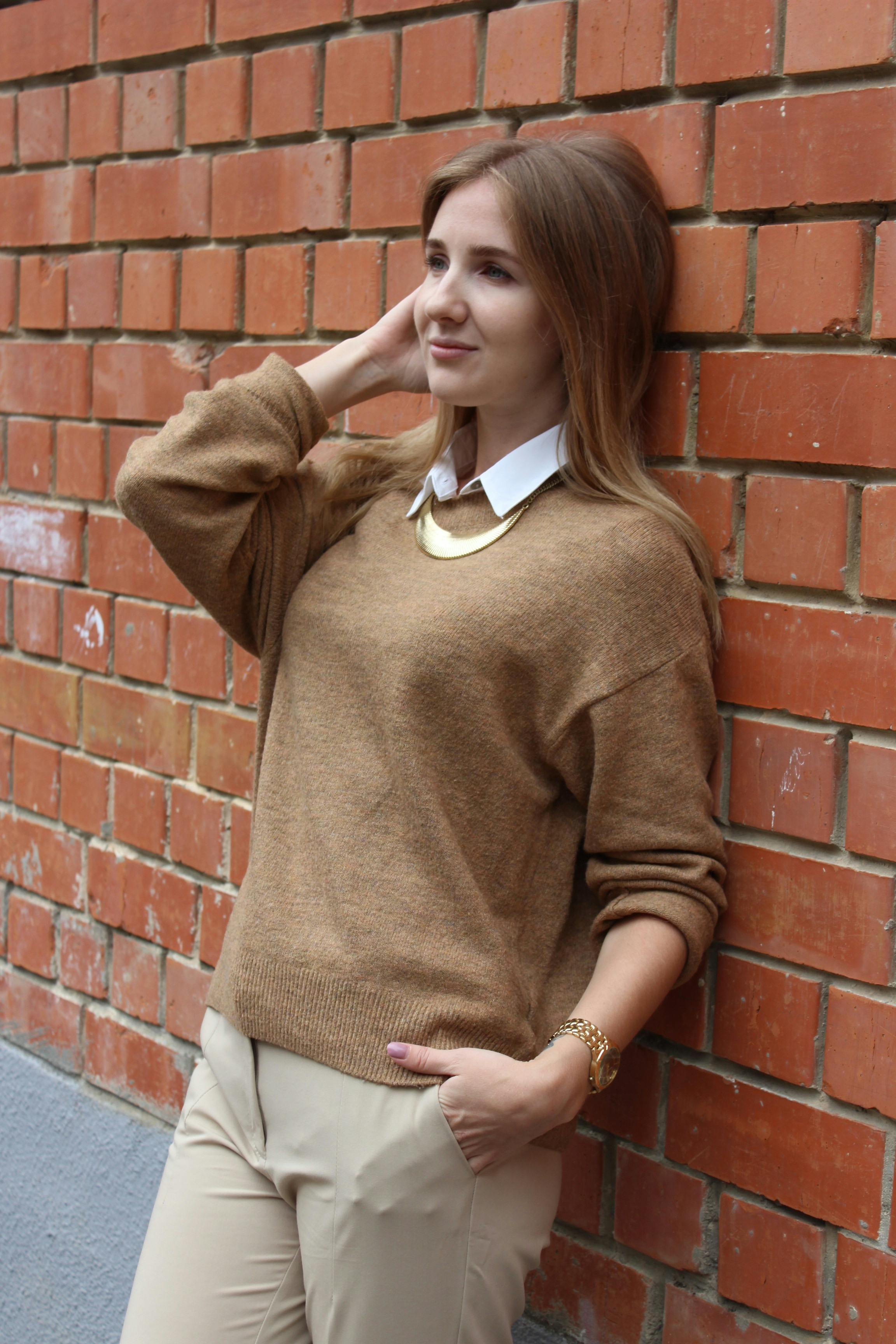 Person Leaning on a Brick Wall · Free Stock Photo