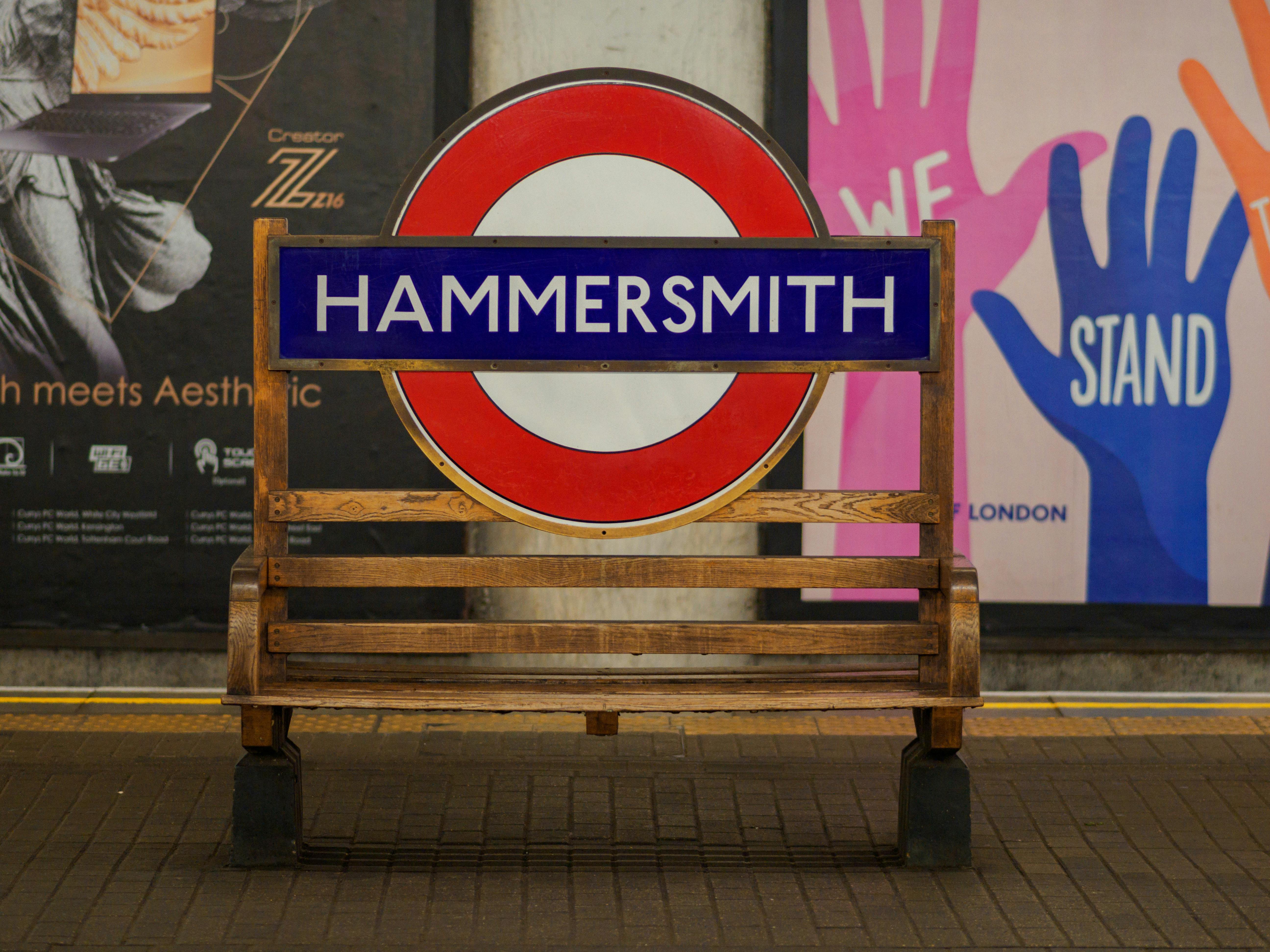 Wooden Bench with Hammersmith Subway Sign · Free Stock Photo