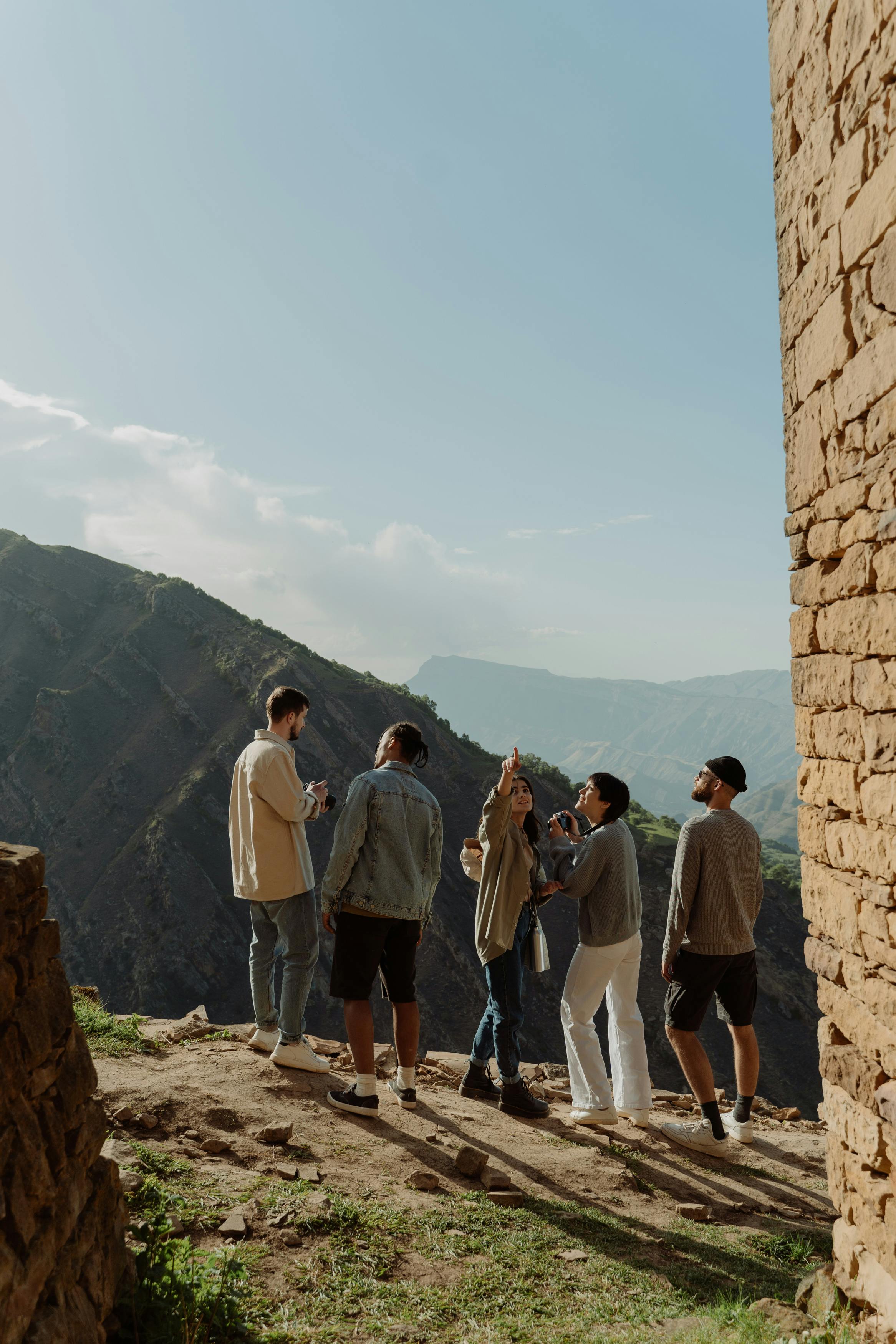 Group of People Standing Near Mountain View · Free Stock Photo