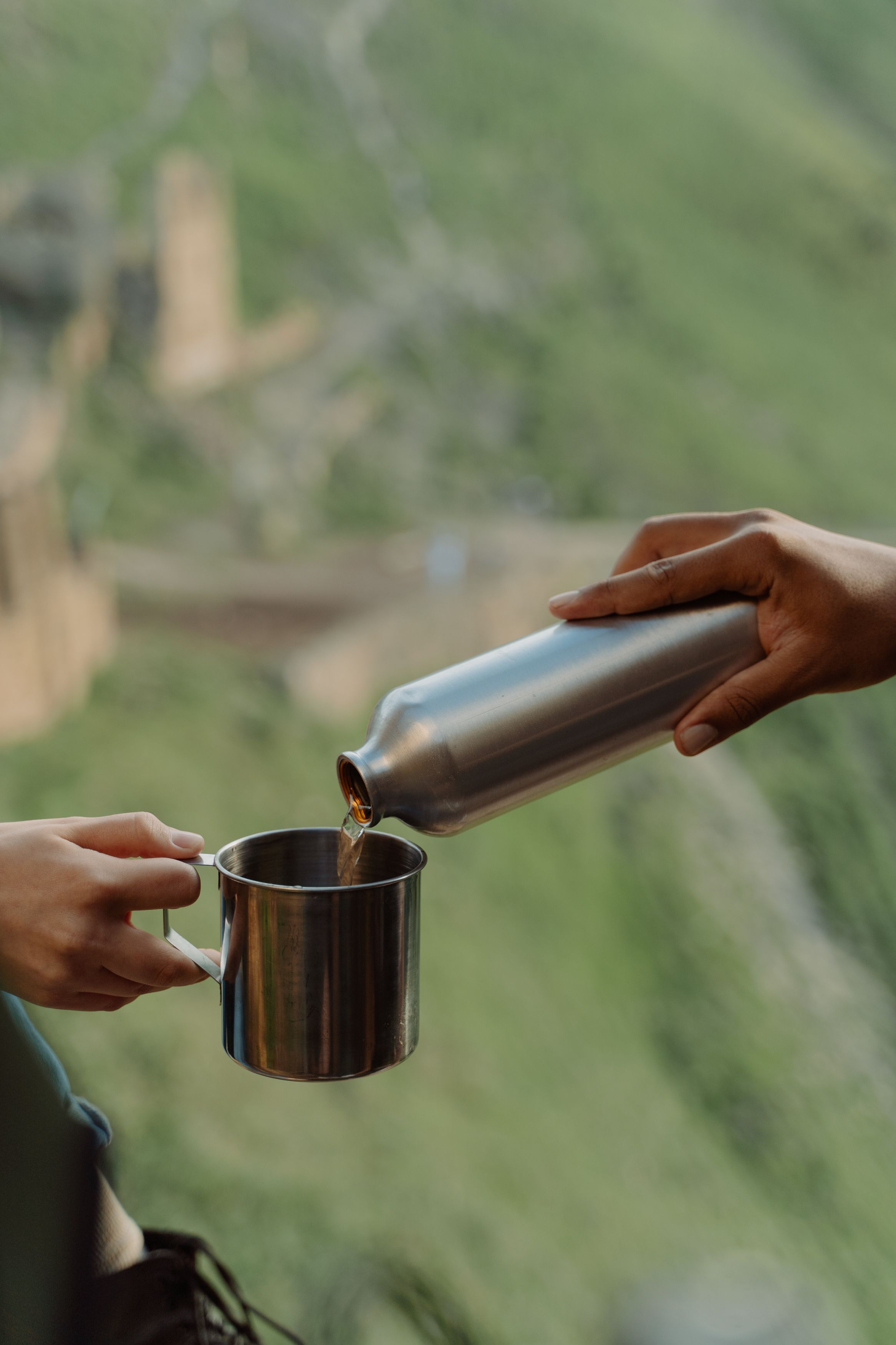 Person Poring Water in a Mug · Free Stock Photo