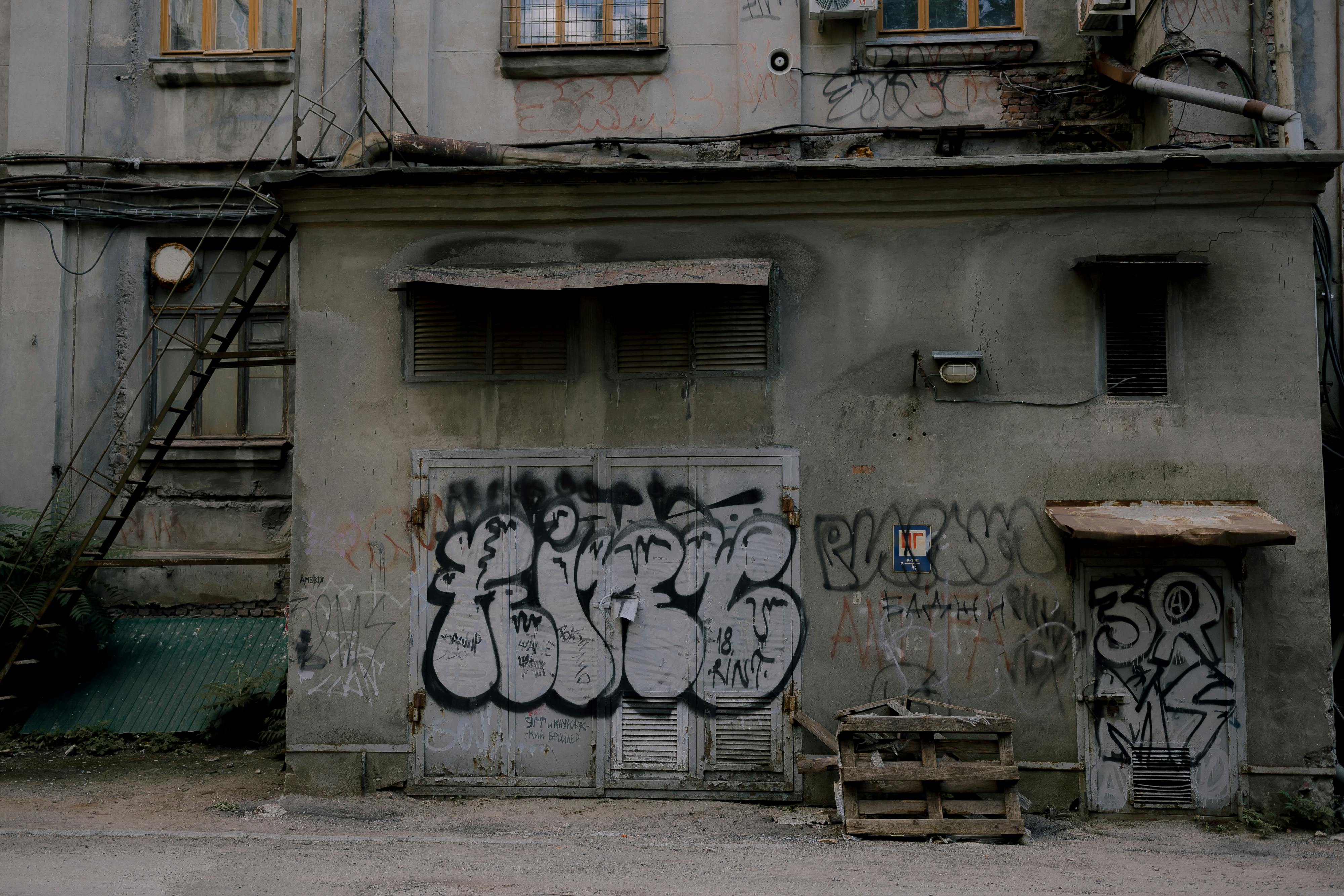 Graffiti Vandalism on Neglected Residential Building · Free Stock Photo