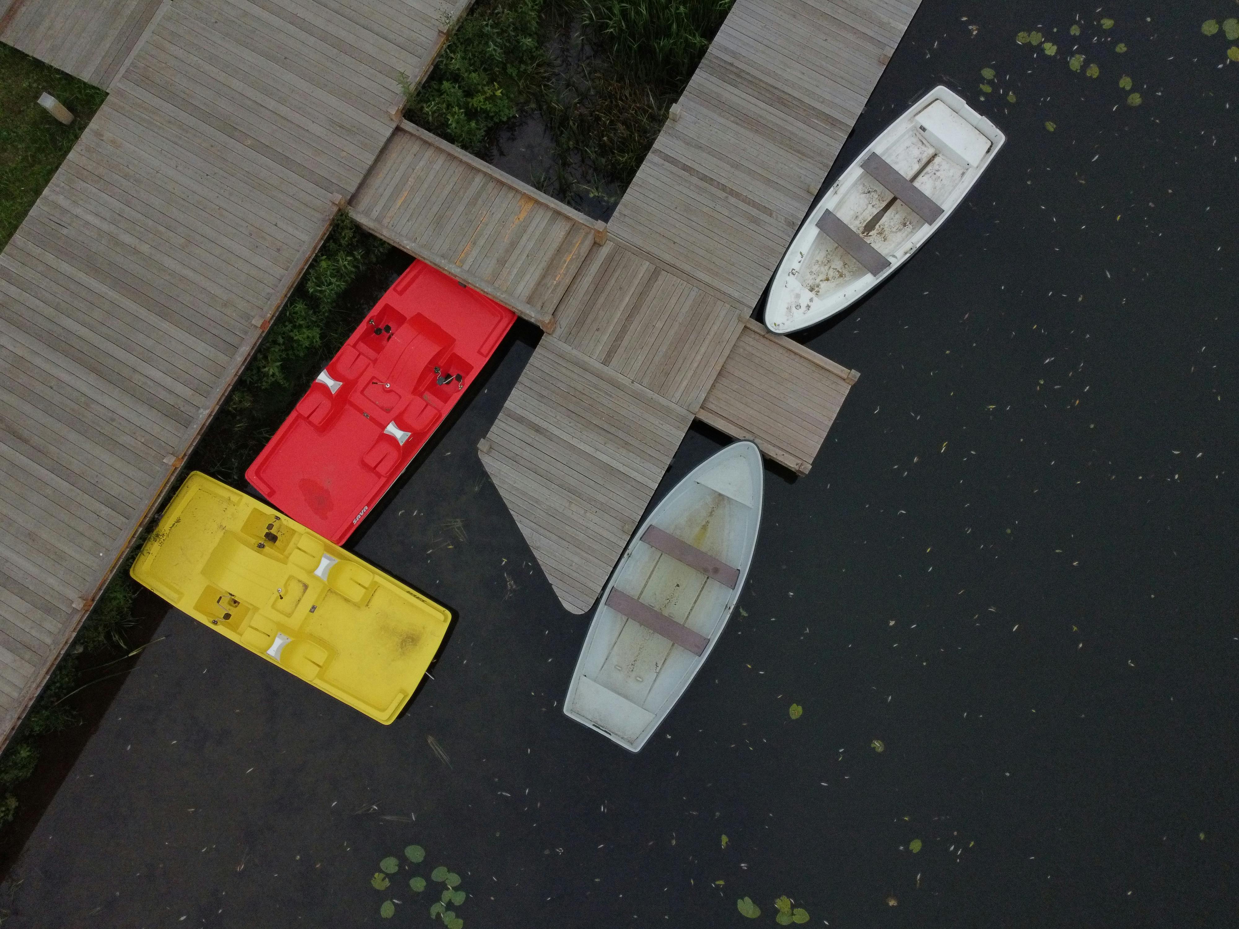 Wooden Small Boat Floating on a Calm Water · Free Stock Photo