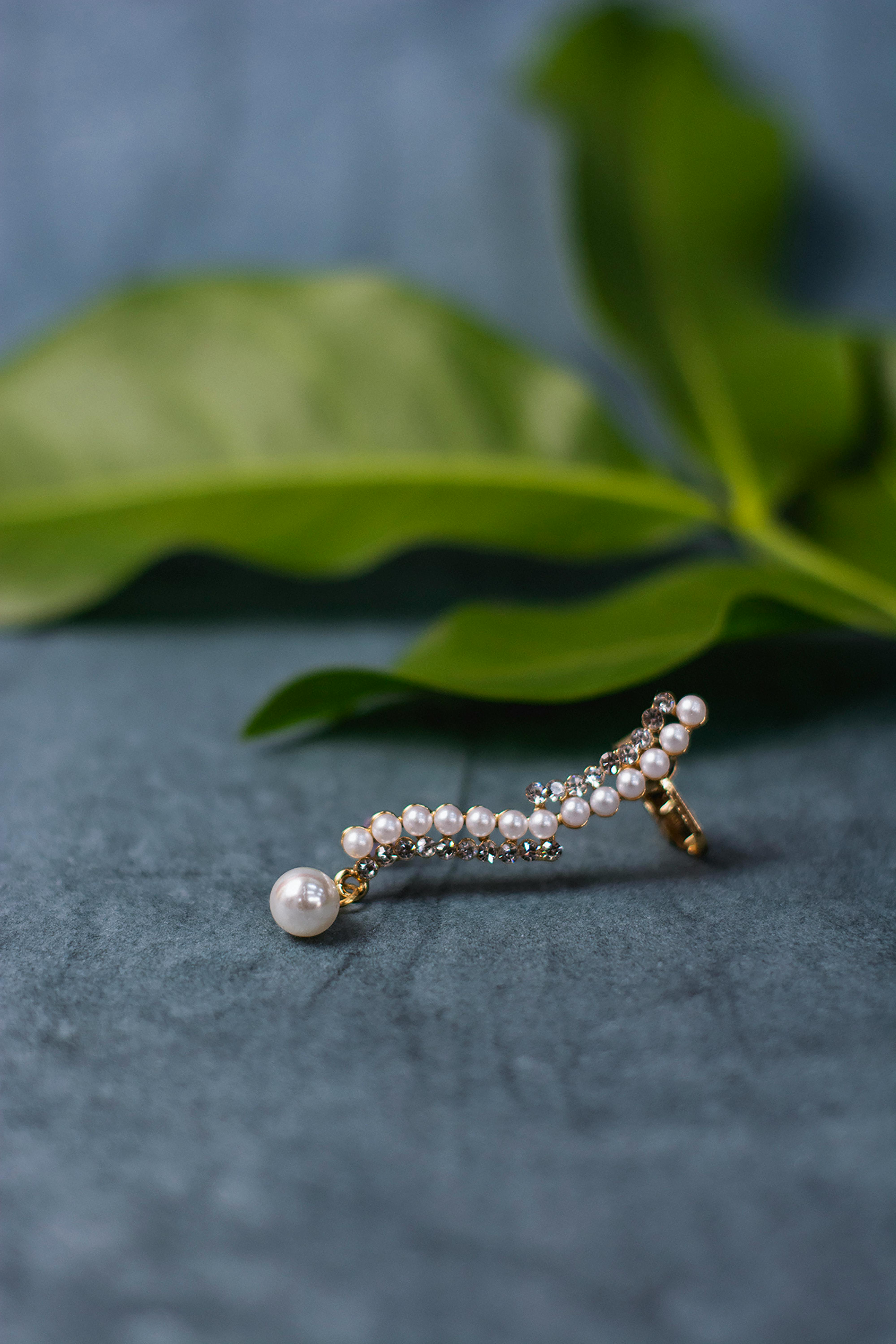 Close-Up View of Pearl Piercing · Free Stock Photo