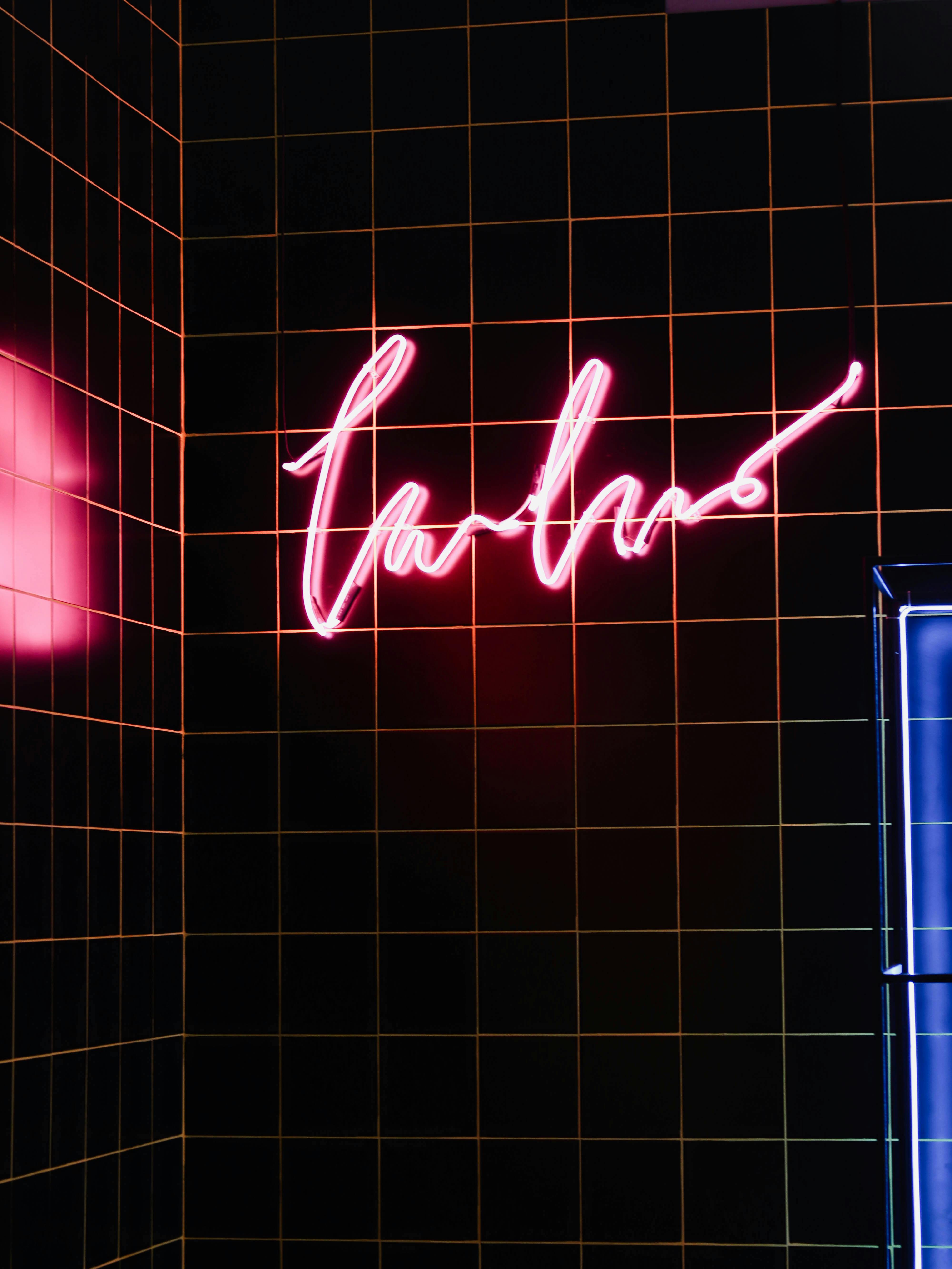 Brown Tiled Wall with Neon Sign · Free Stock Photo