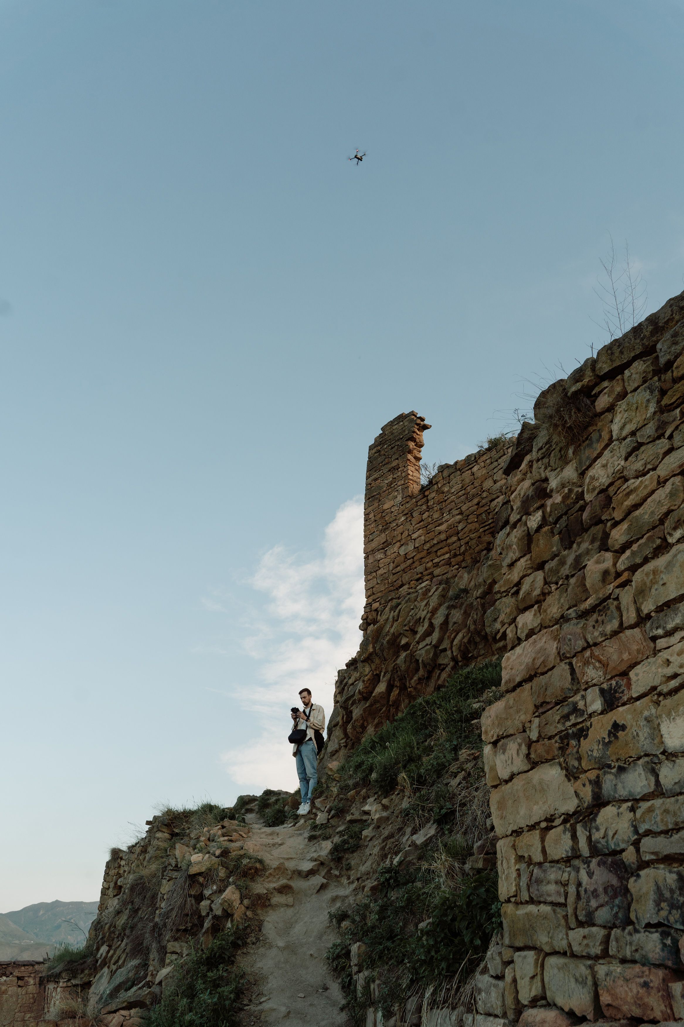 Man Standing on Stone in Wild Nature · Free Stock Photo