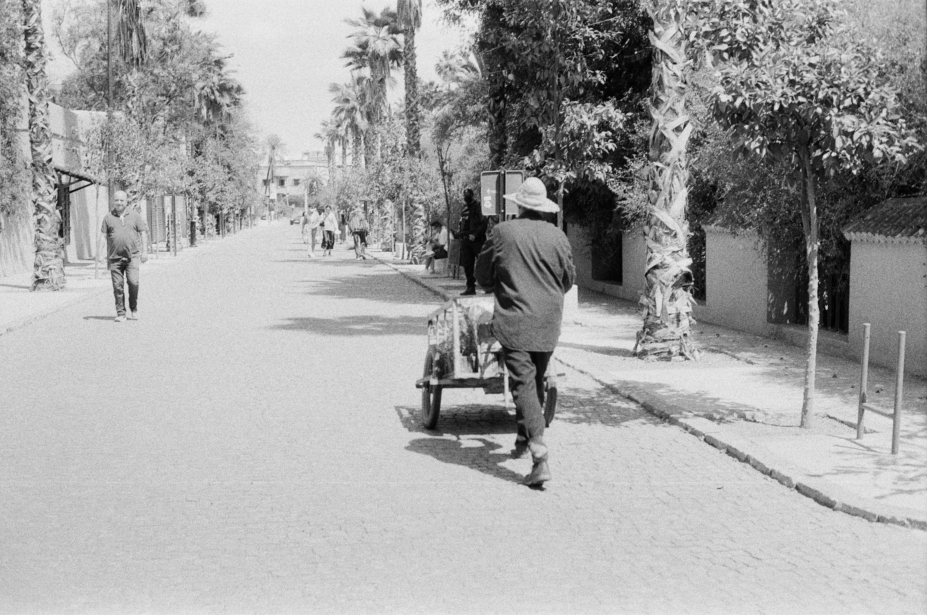 Man Pulling Cart on Street · Free Stock Photo