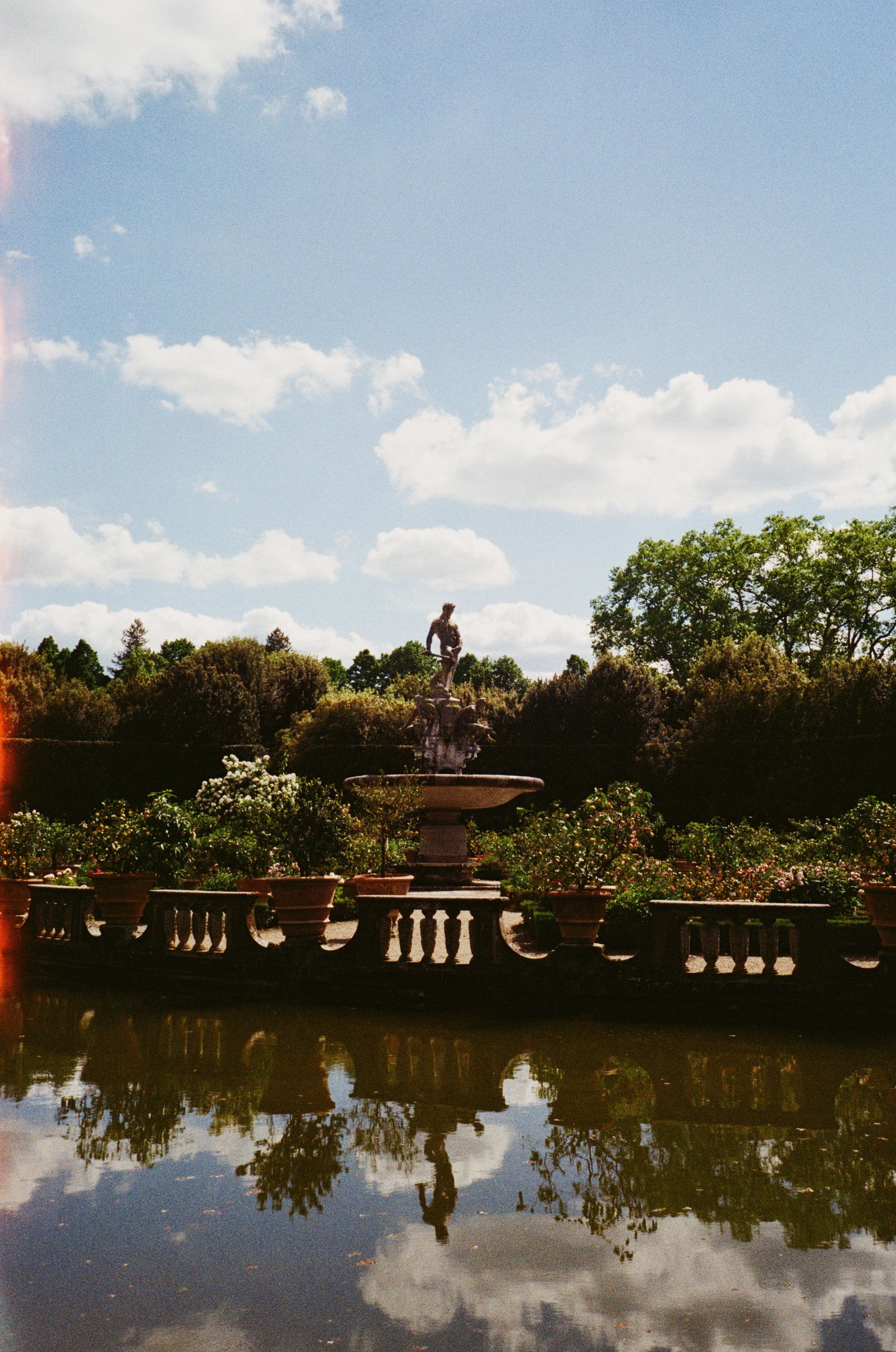 Brown Concrete Statue Near Green Trees on a Park · Free Stock Photo