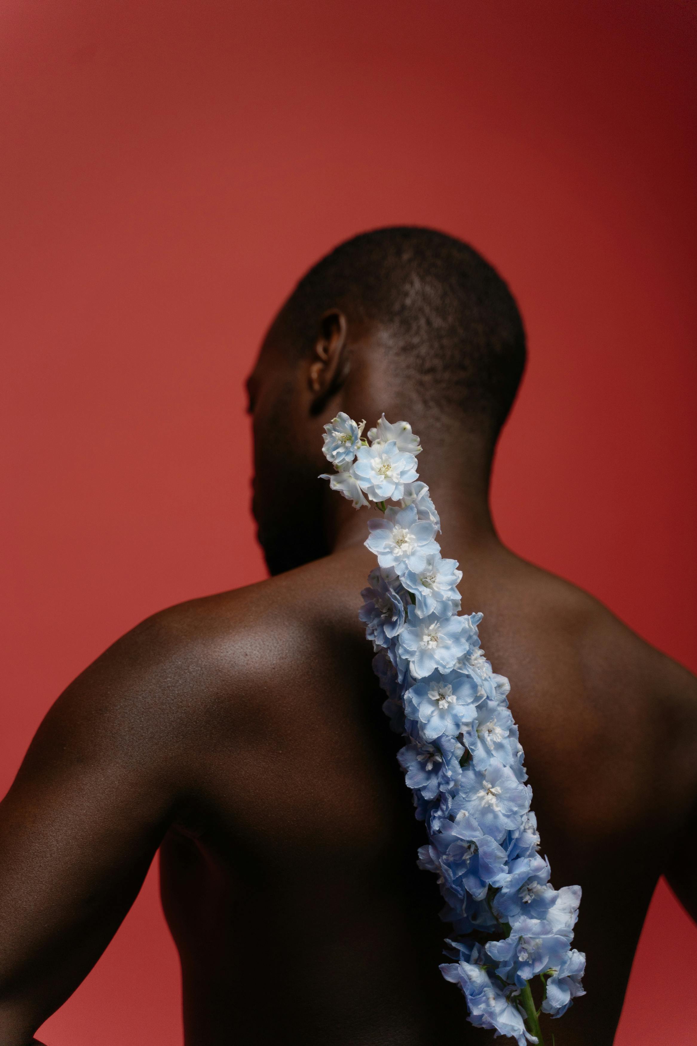 Back and Neck of a Shirtless Man · Free Stock Photo