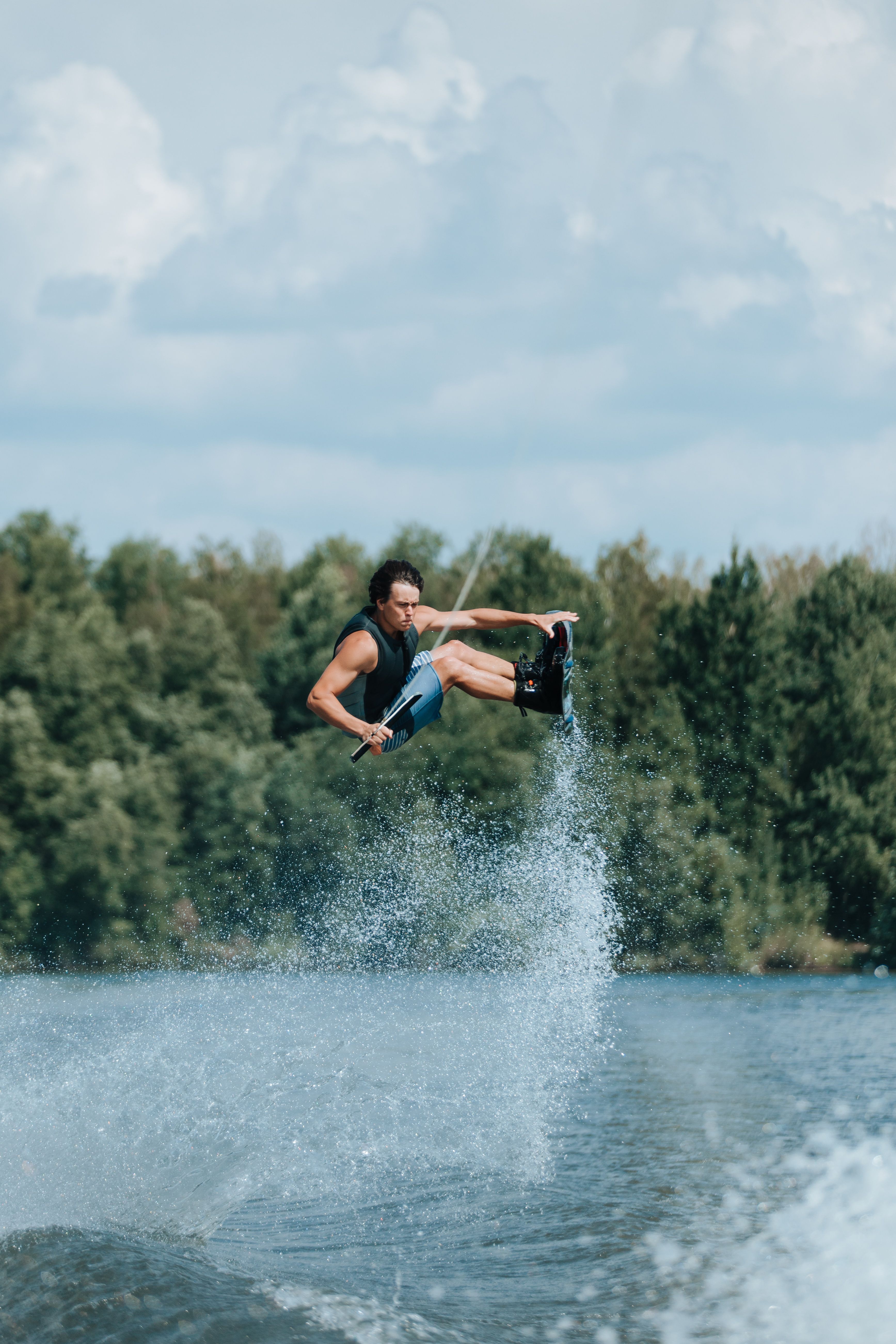 Man Wakeboarding over Body of Water · Free Stock Photo