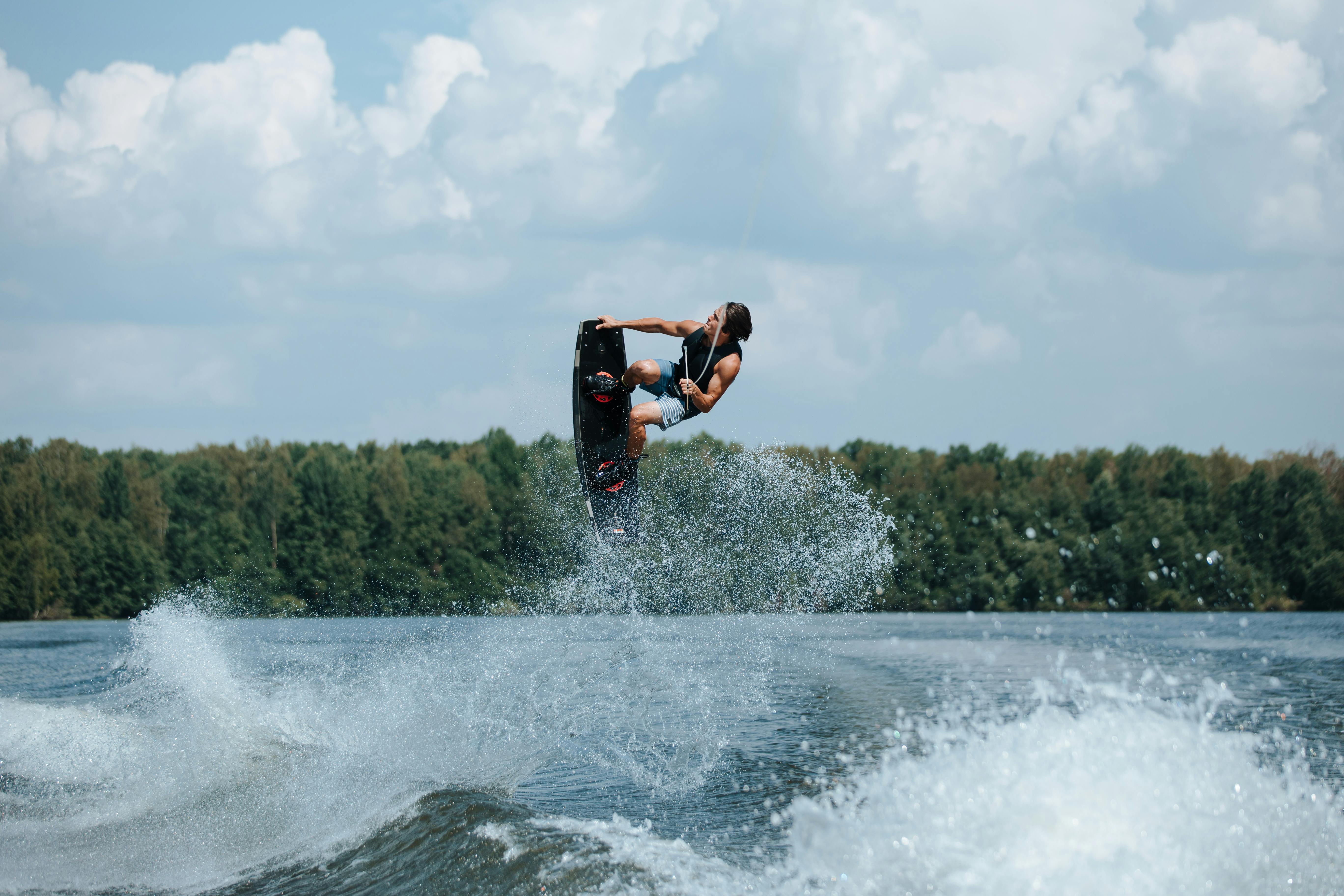 Man Riding a Wakeboard in Mid-Air · Free Stock Photo