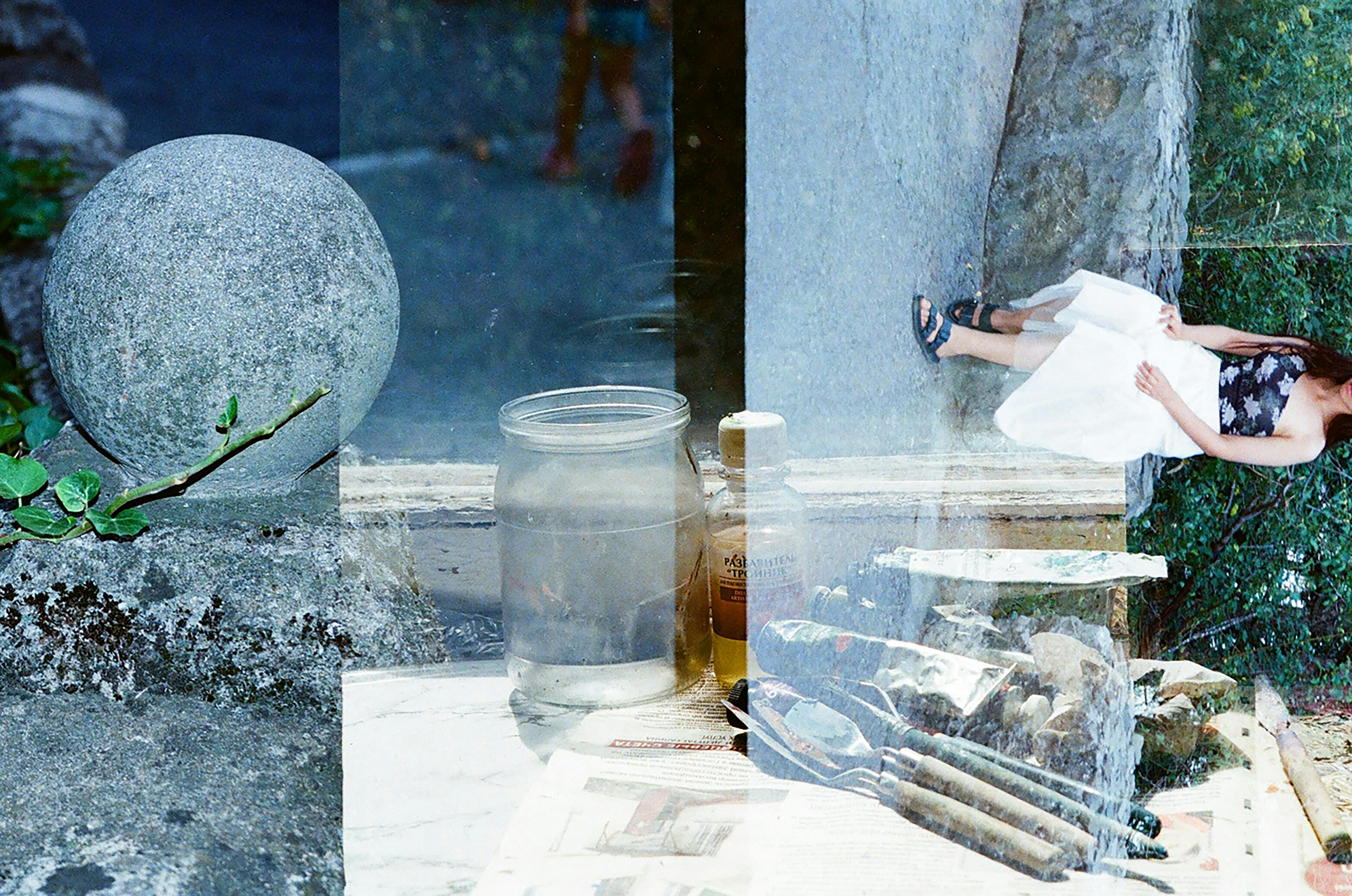Glass with a Reflection of a Woman and a Jar and Spoons · Free Stock Photo