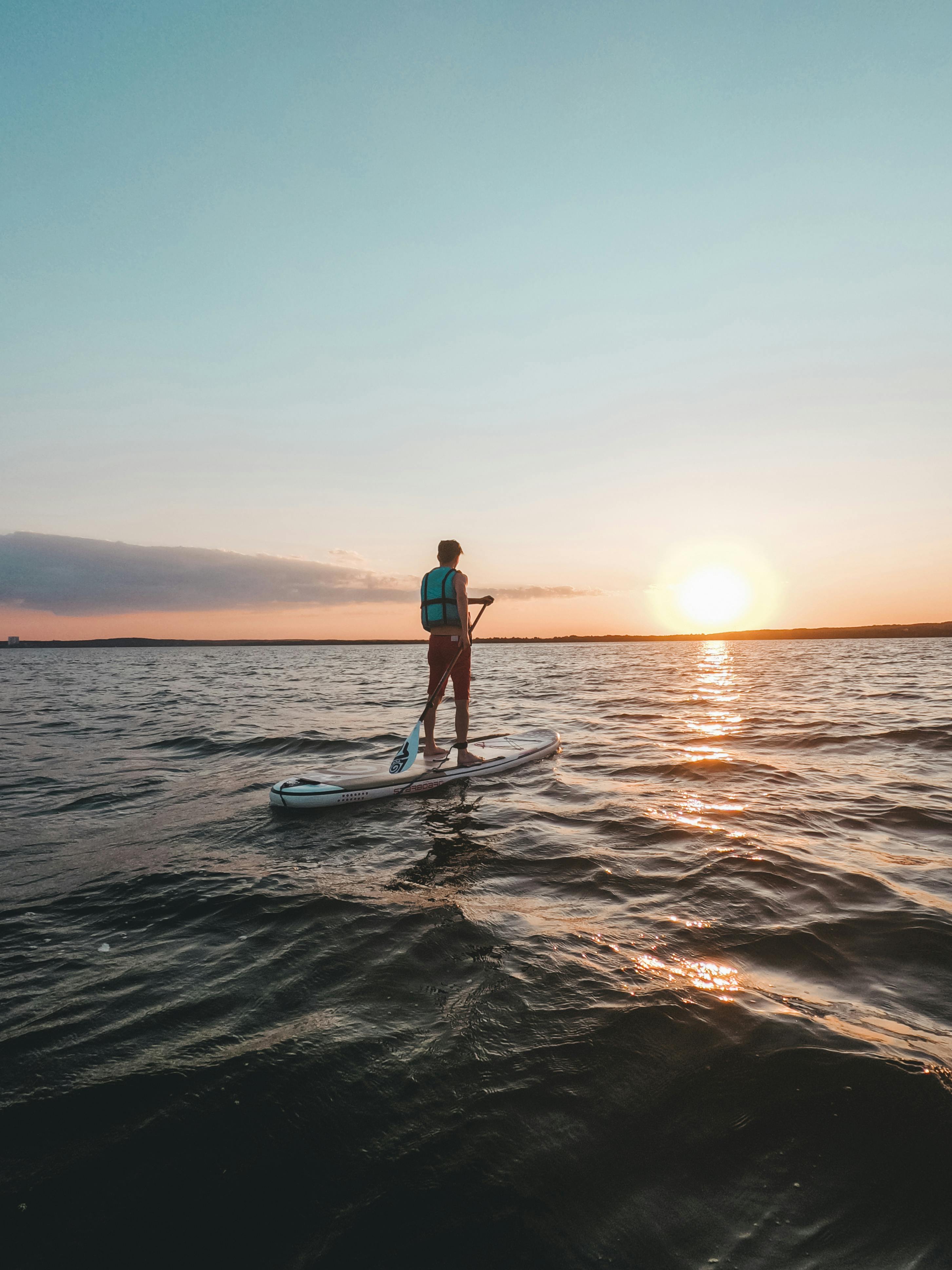 Woman Swimming on Paddleboard on Lake · Free Stock Photo