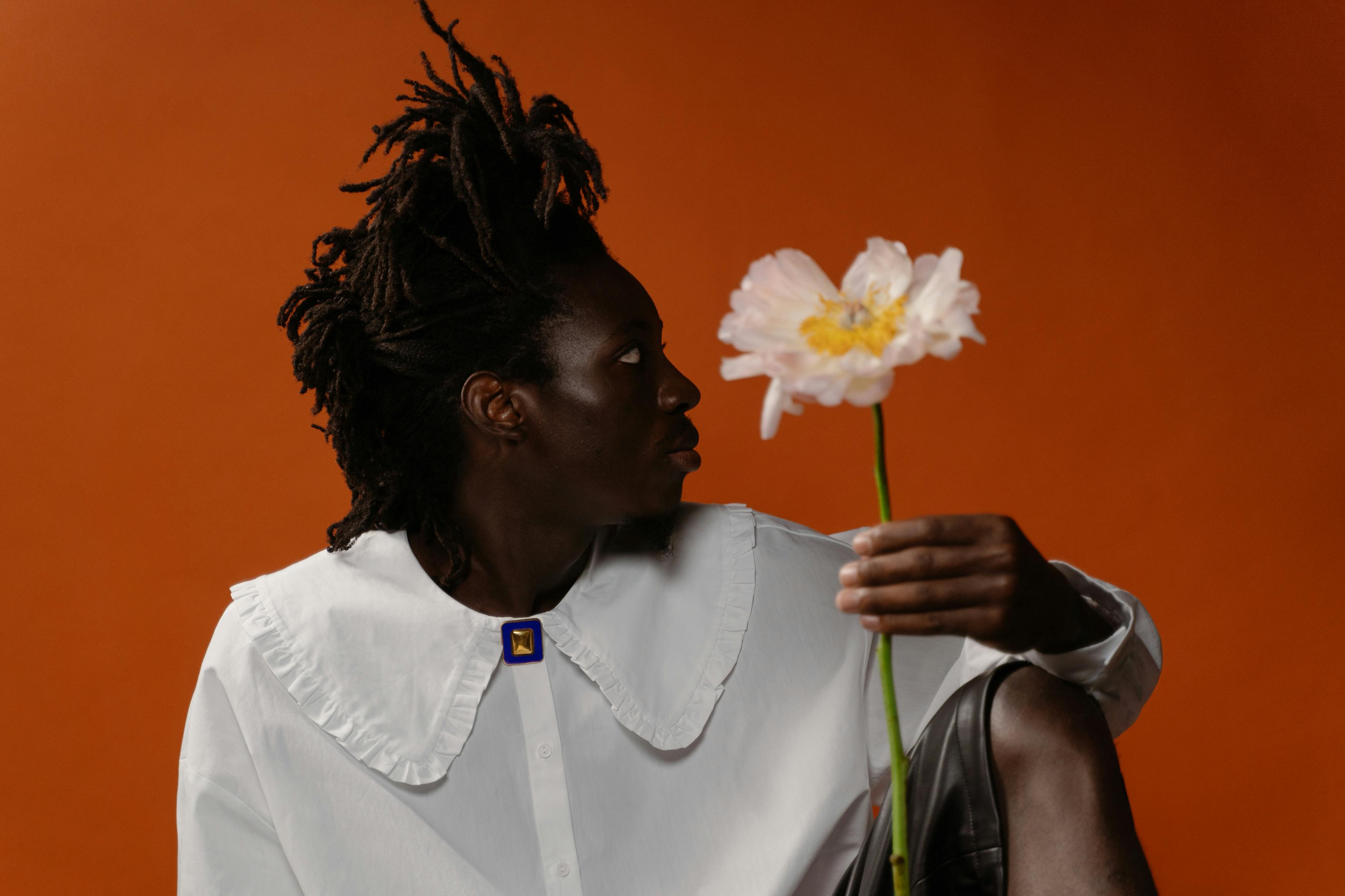 Man Holding a Flower · Free Stock Photo