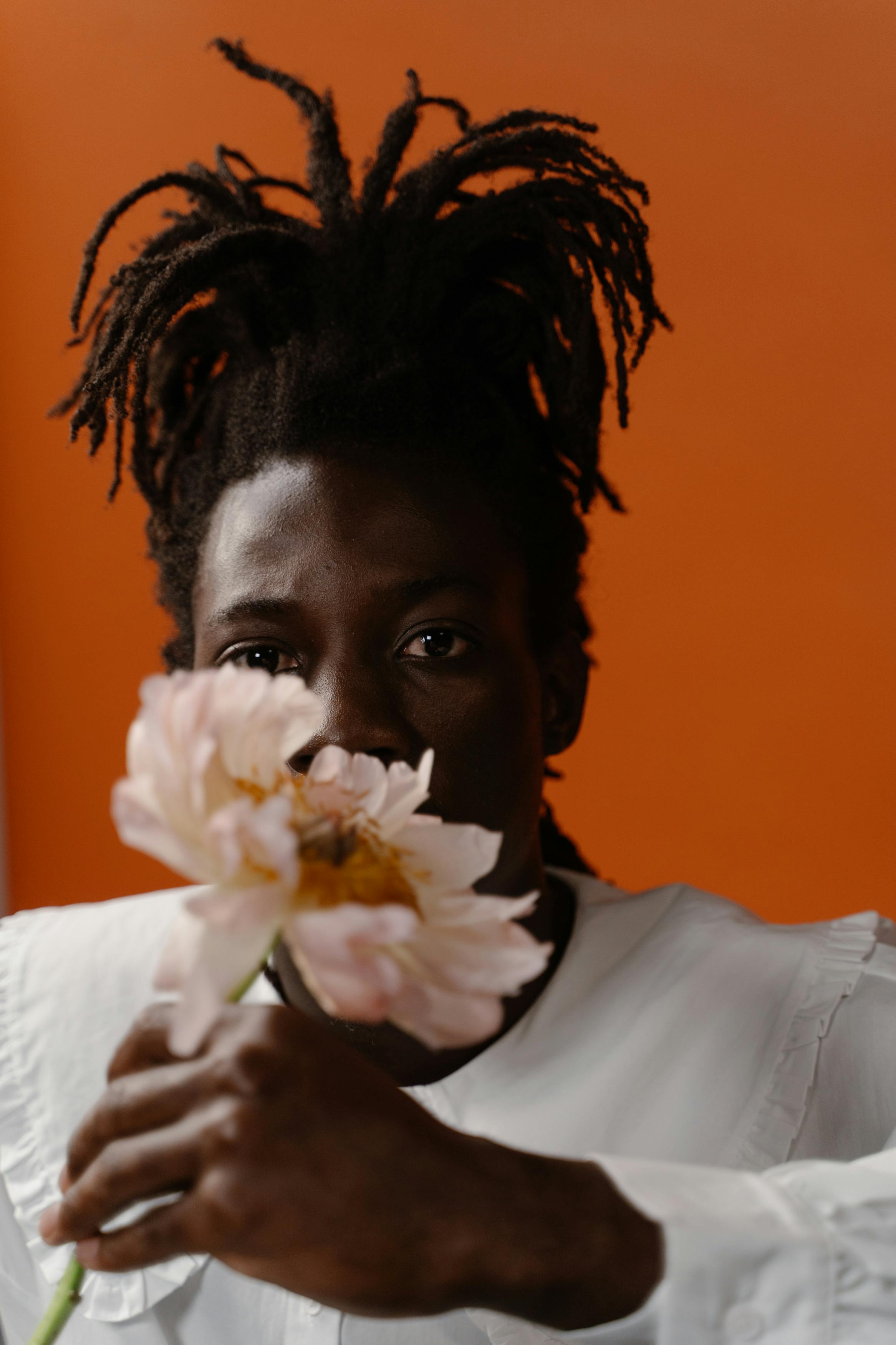 Man Holding a Flower · Free Stock Photo