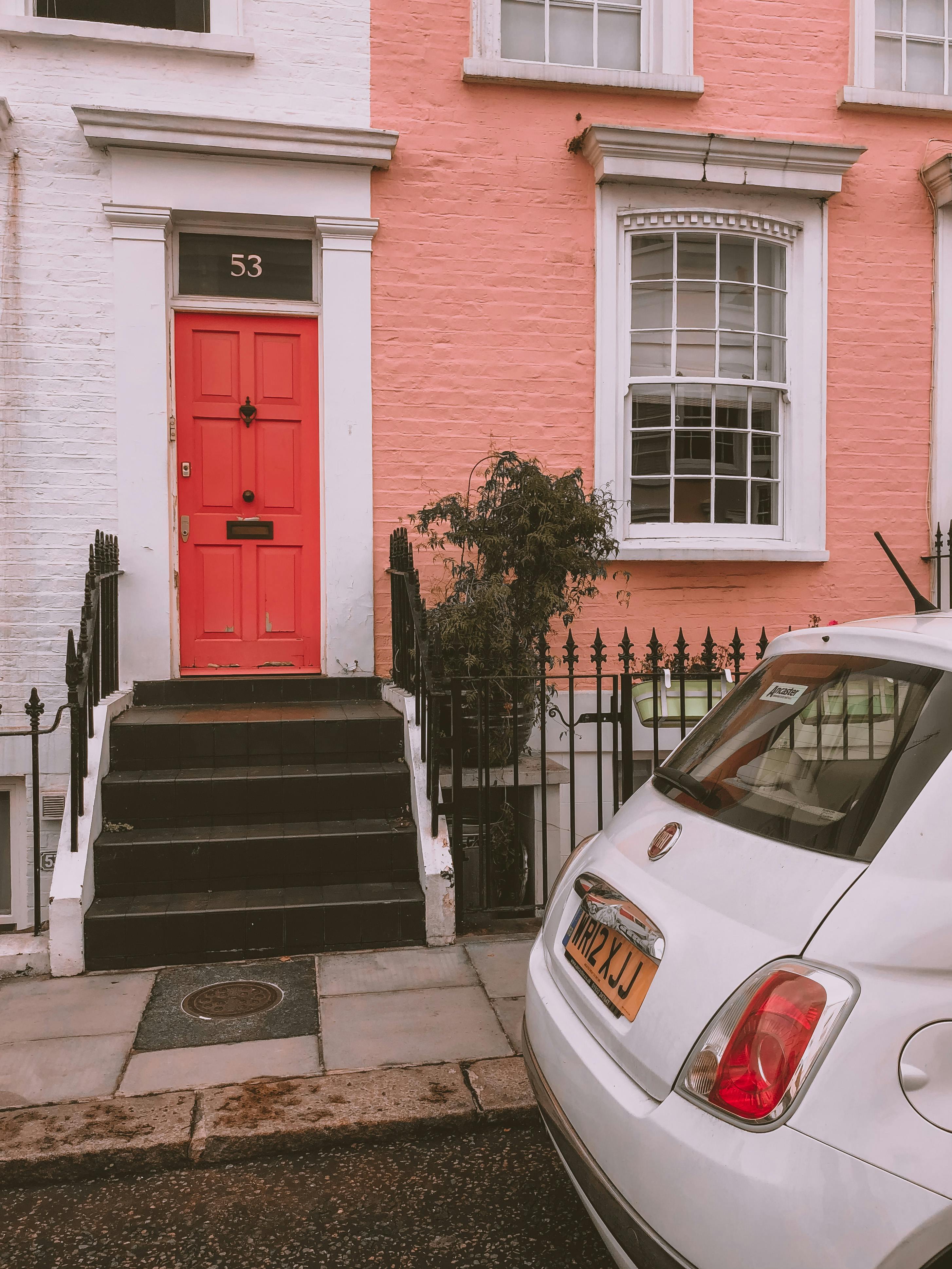 Parked Car outside a House · Free Stock Photo