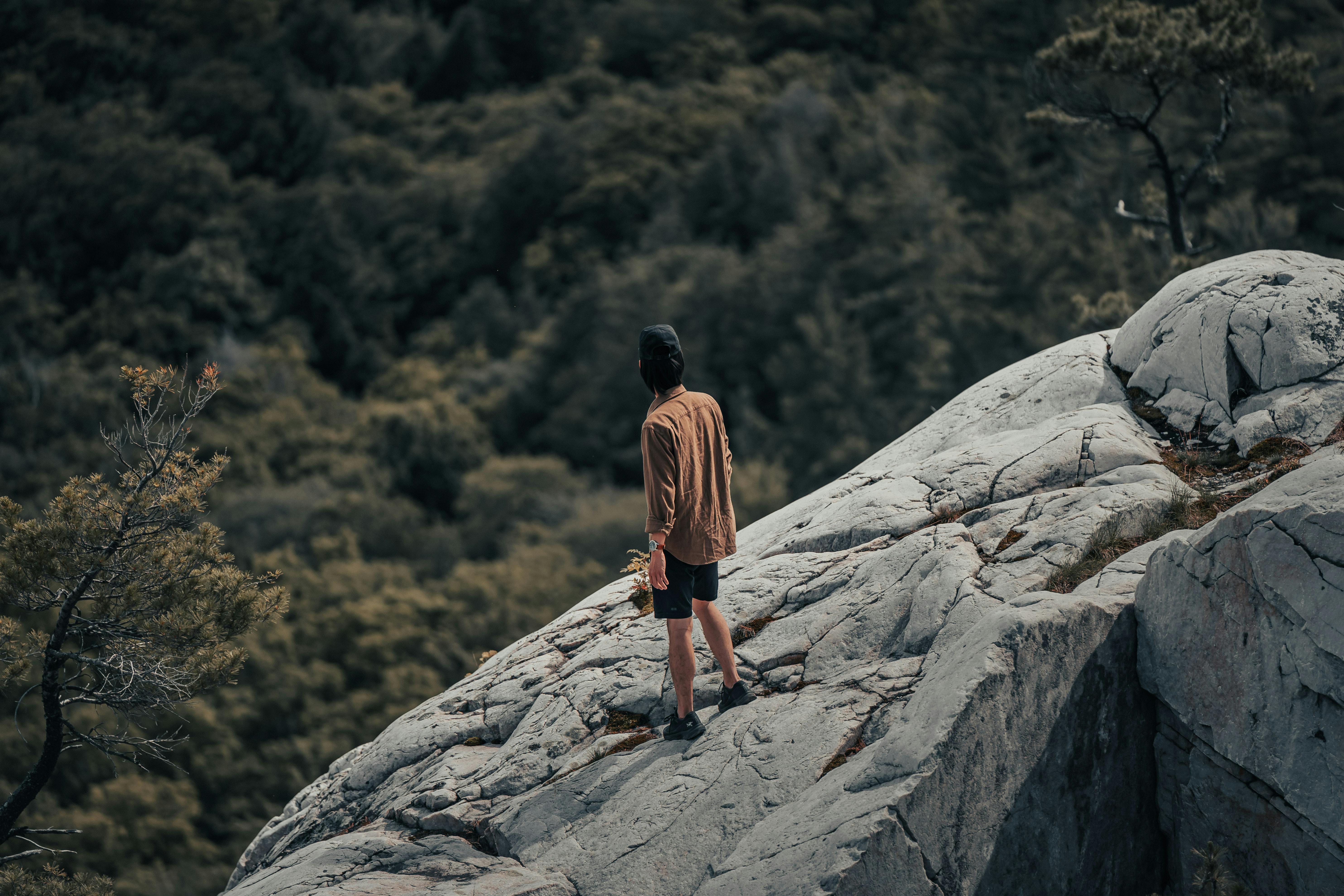 A Person Standing on a Cliff · Free Stock Photo