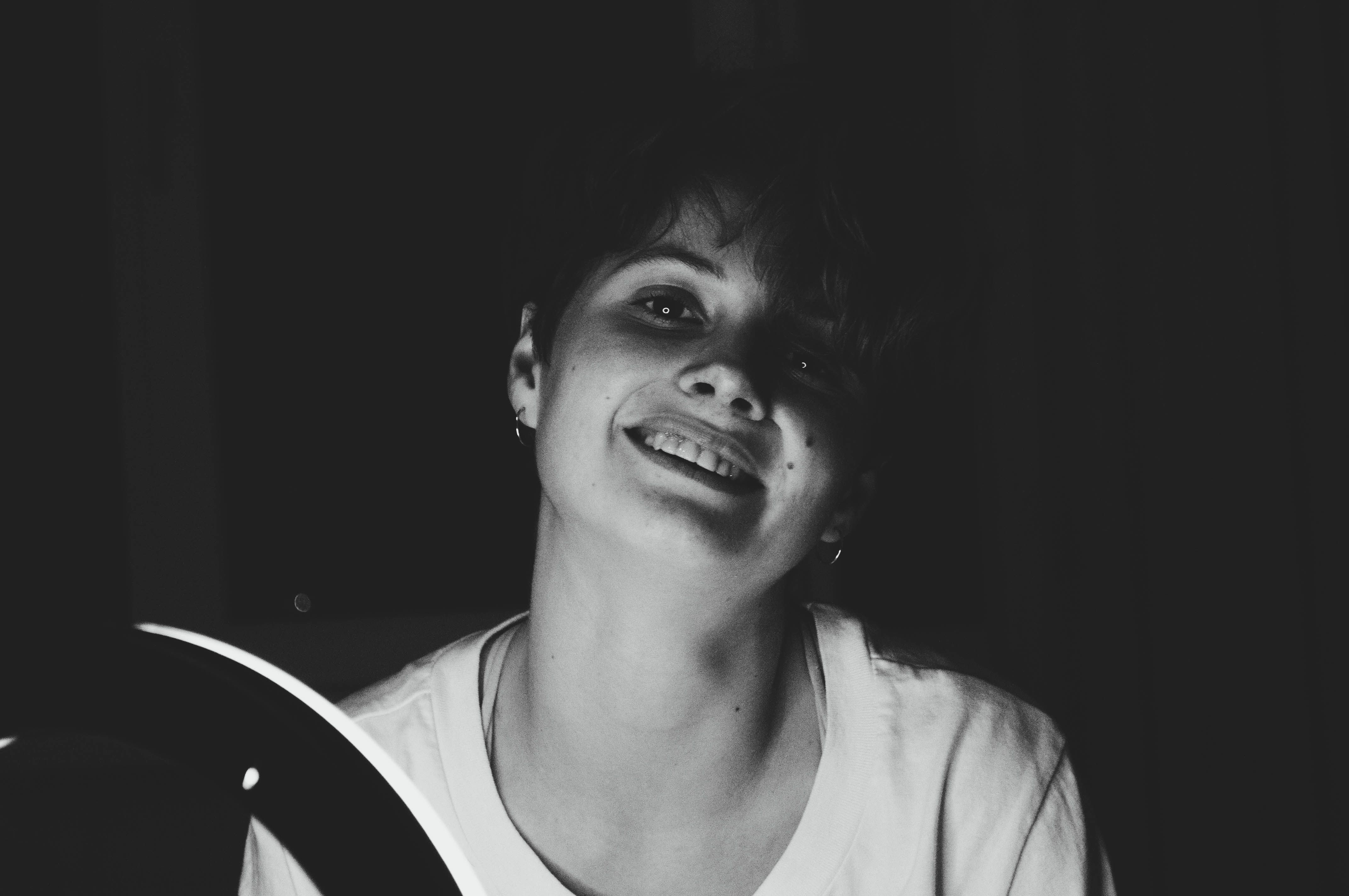 Grayscale Photo of Smiling Woman · Free Stock Photo