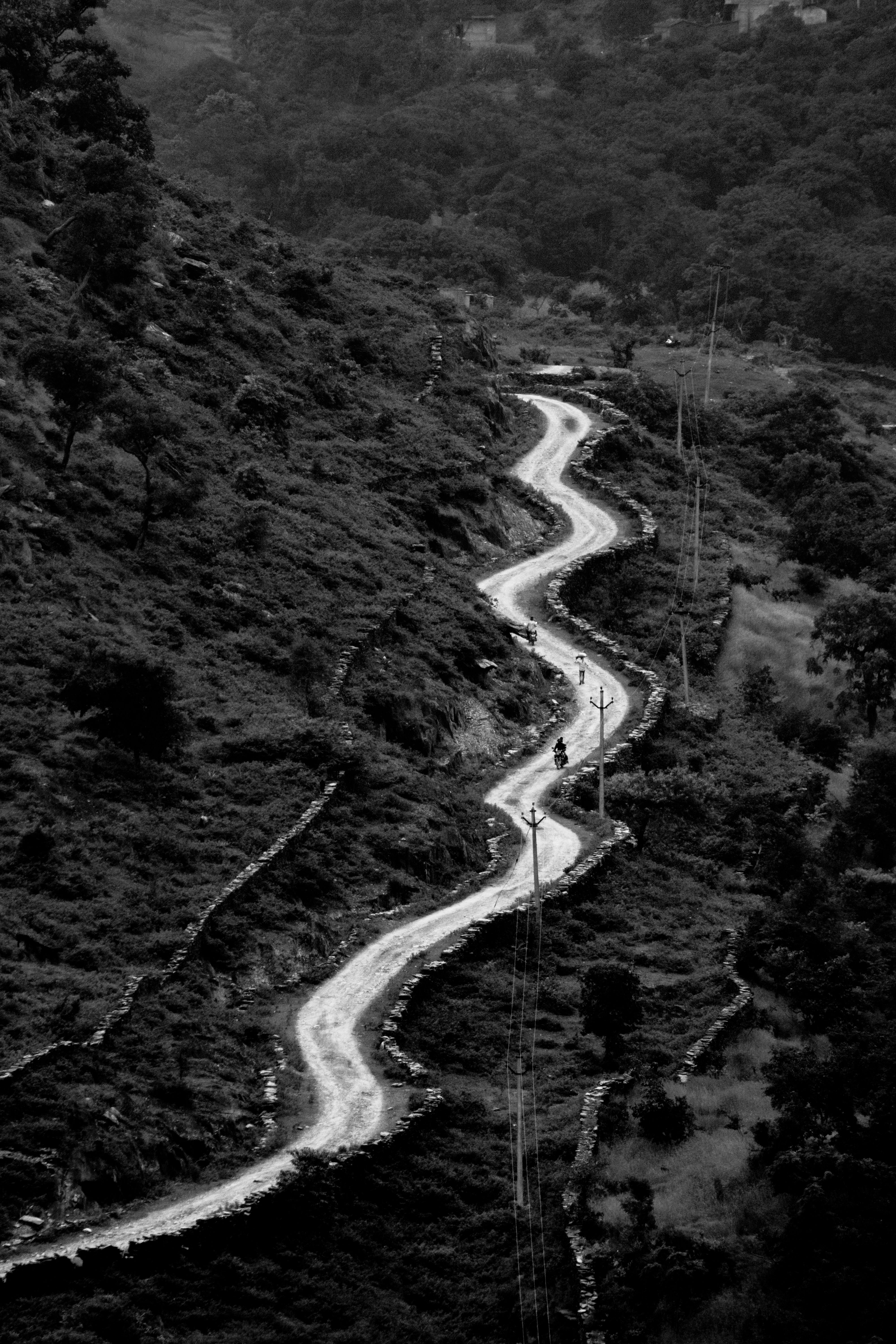 Grayscale Photo of Road on Hillside · Free Stock Photo