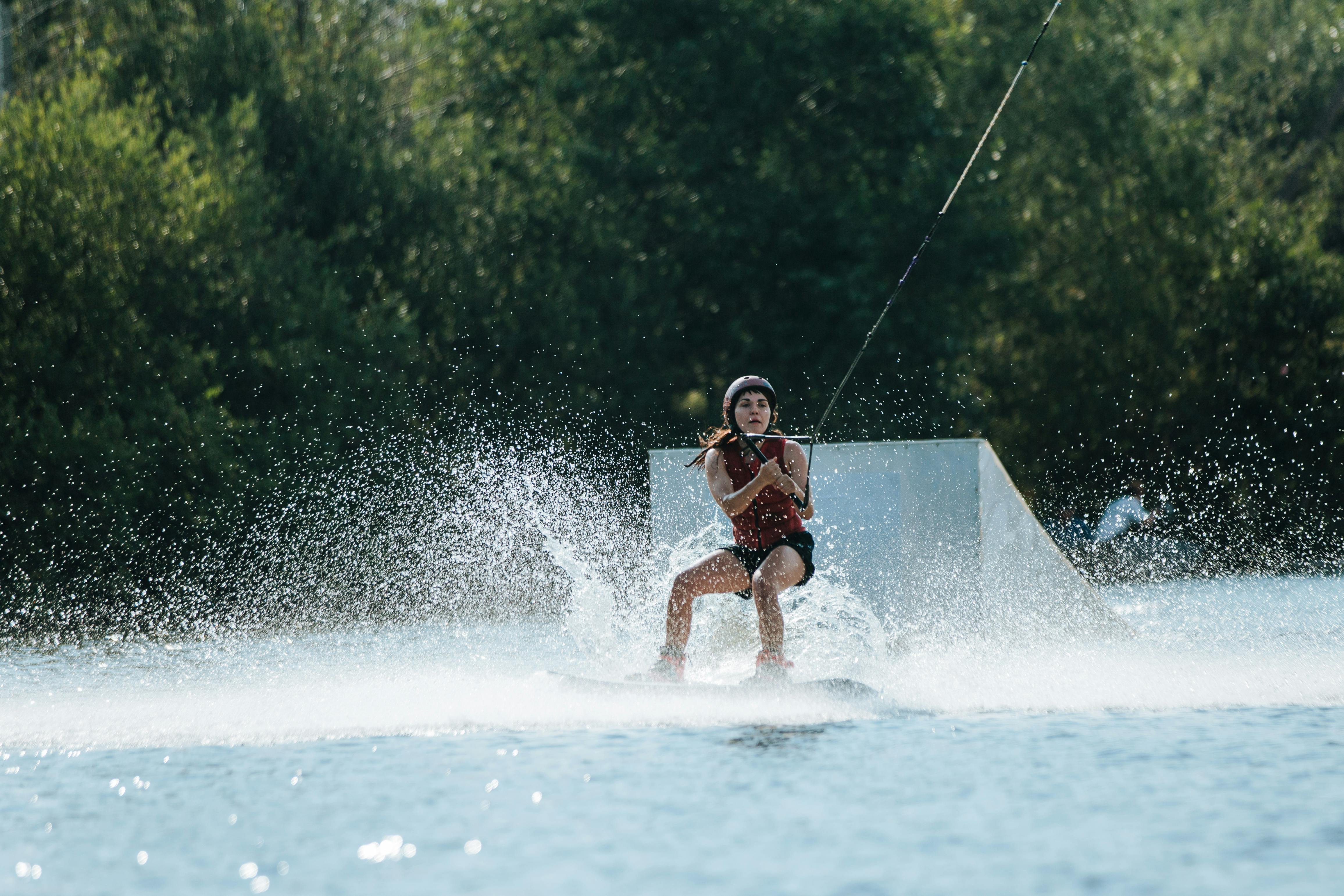Woman Focused on Wakeboarding on Lake · Free Stock Photo