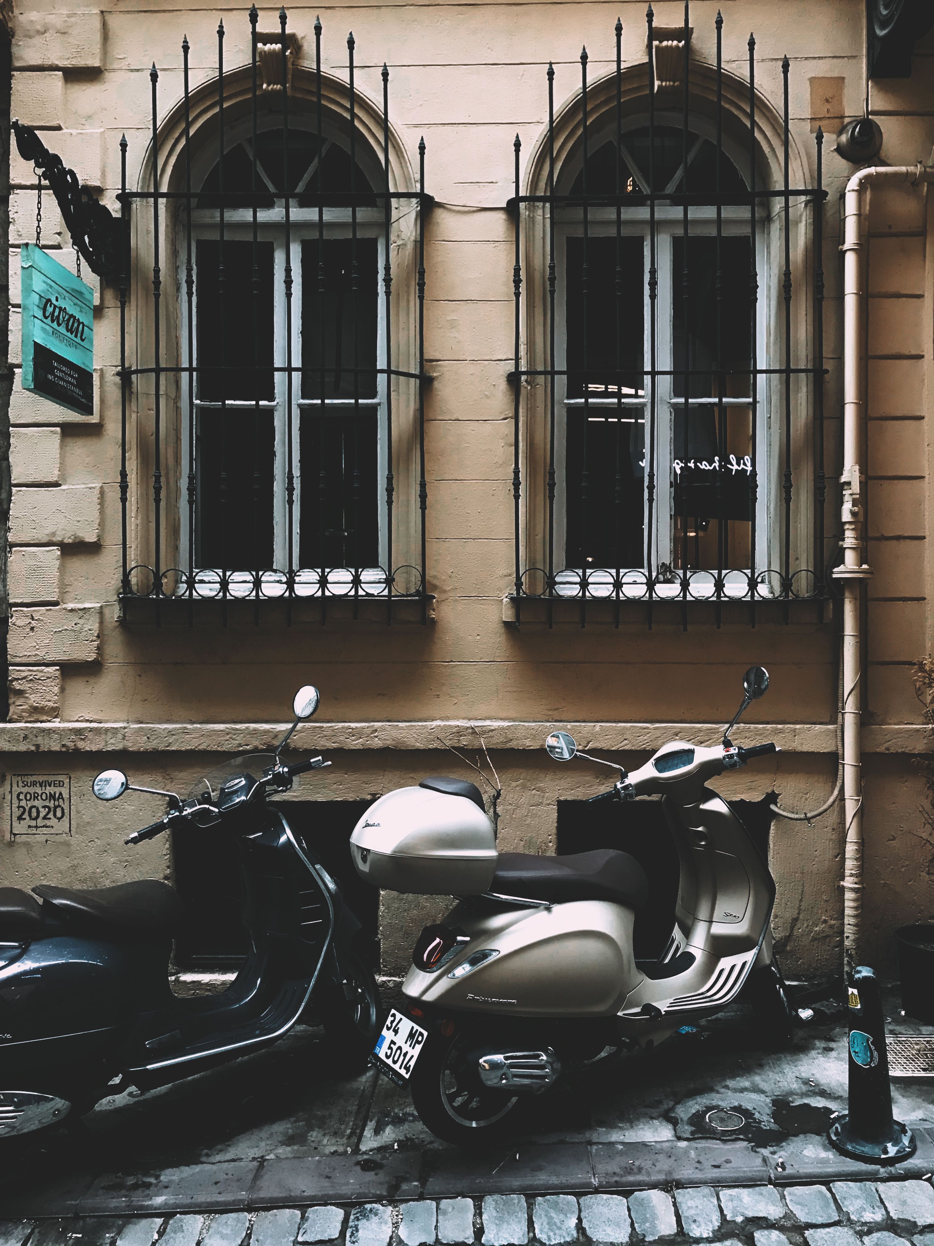 Photo of Motorcycles Parked near a Building · Free Stock Photo