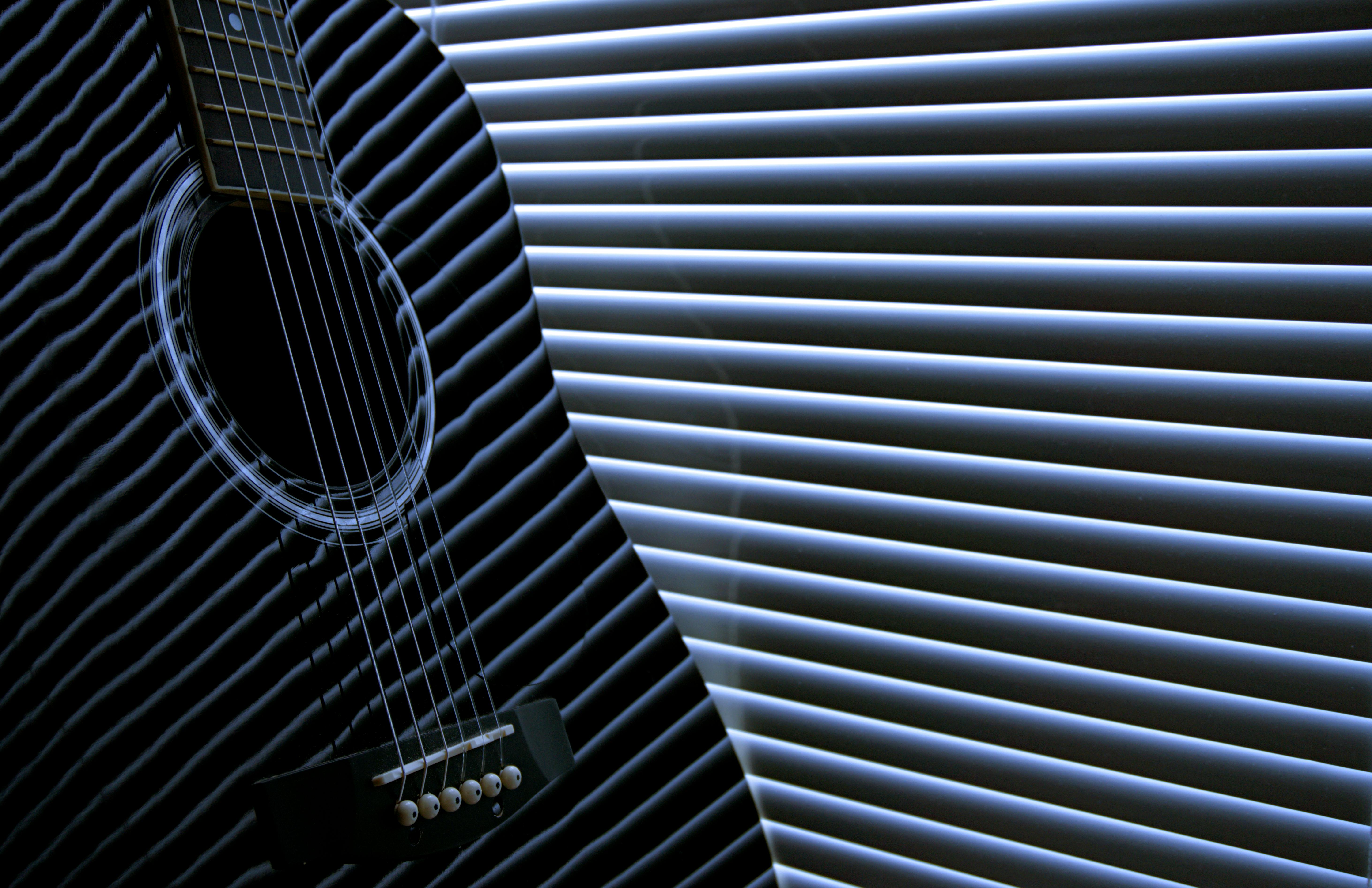 Close Up Photo of Acoustic Guitar Near Blinds · Free Stock Photo